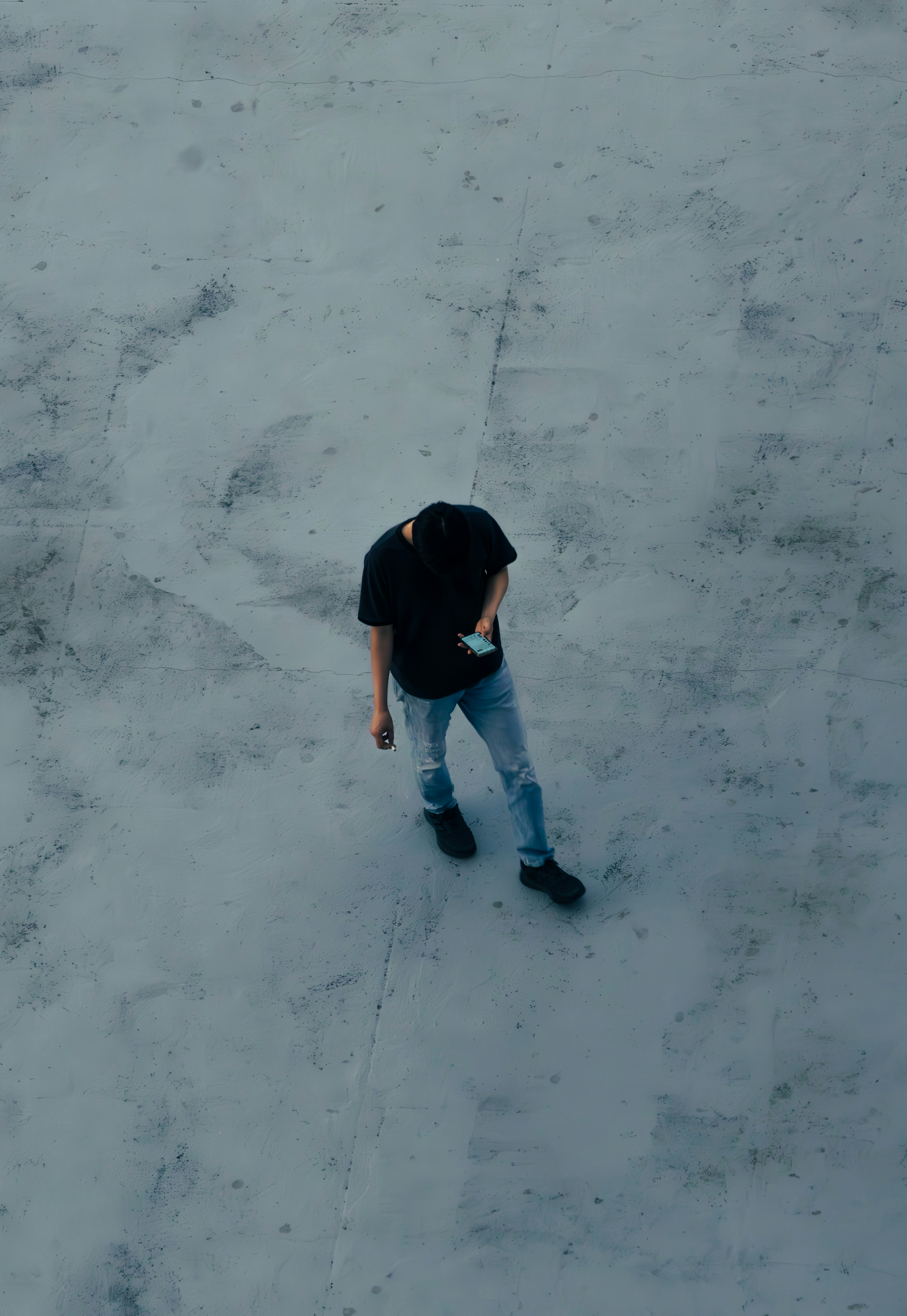 A man walking across a snow covered ground