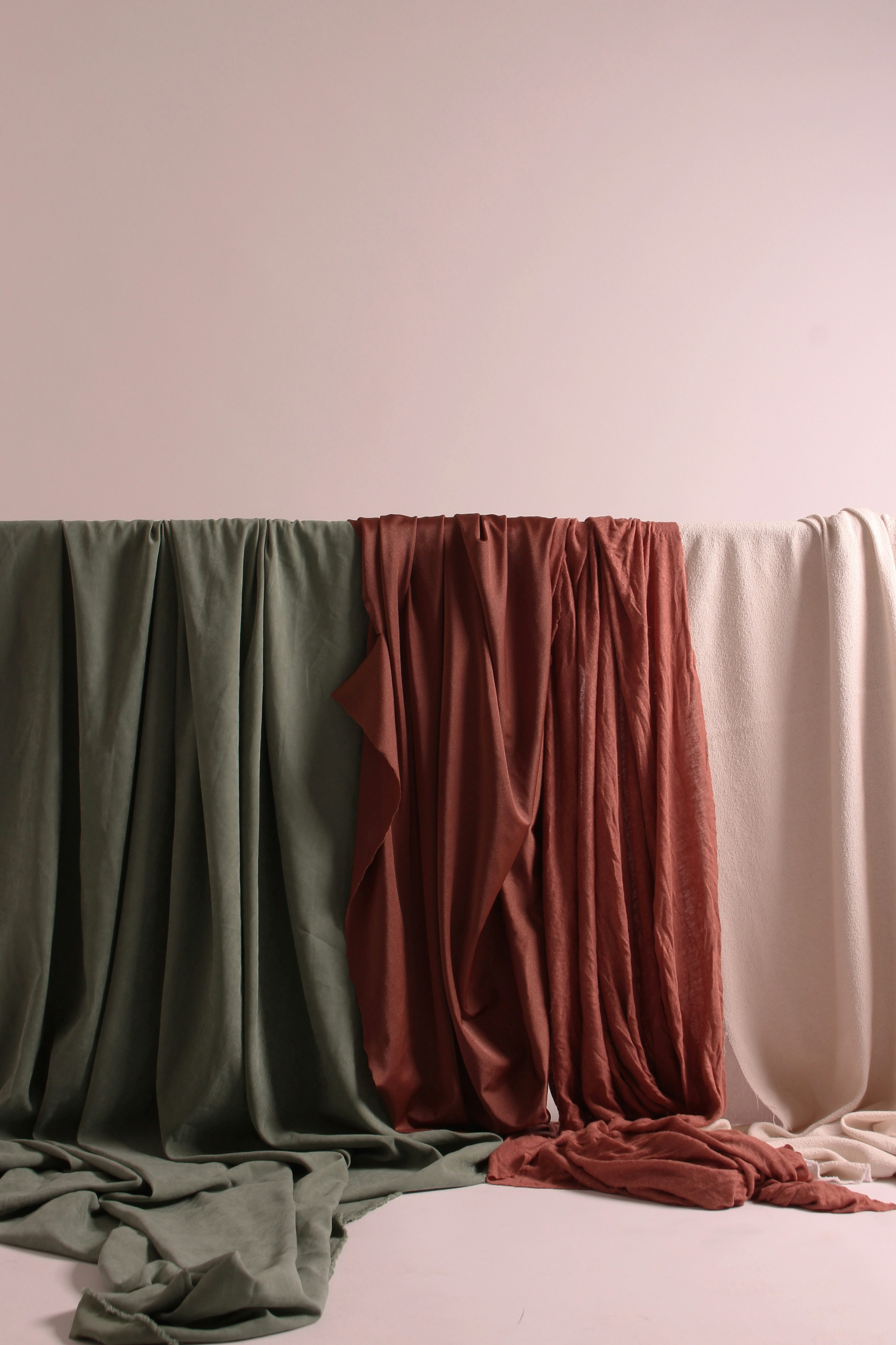 A group of four different colored sheets on a bed photo – Free Texture ...