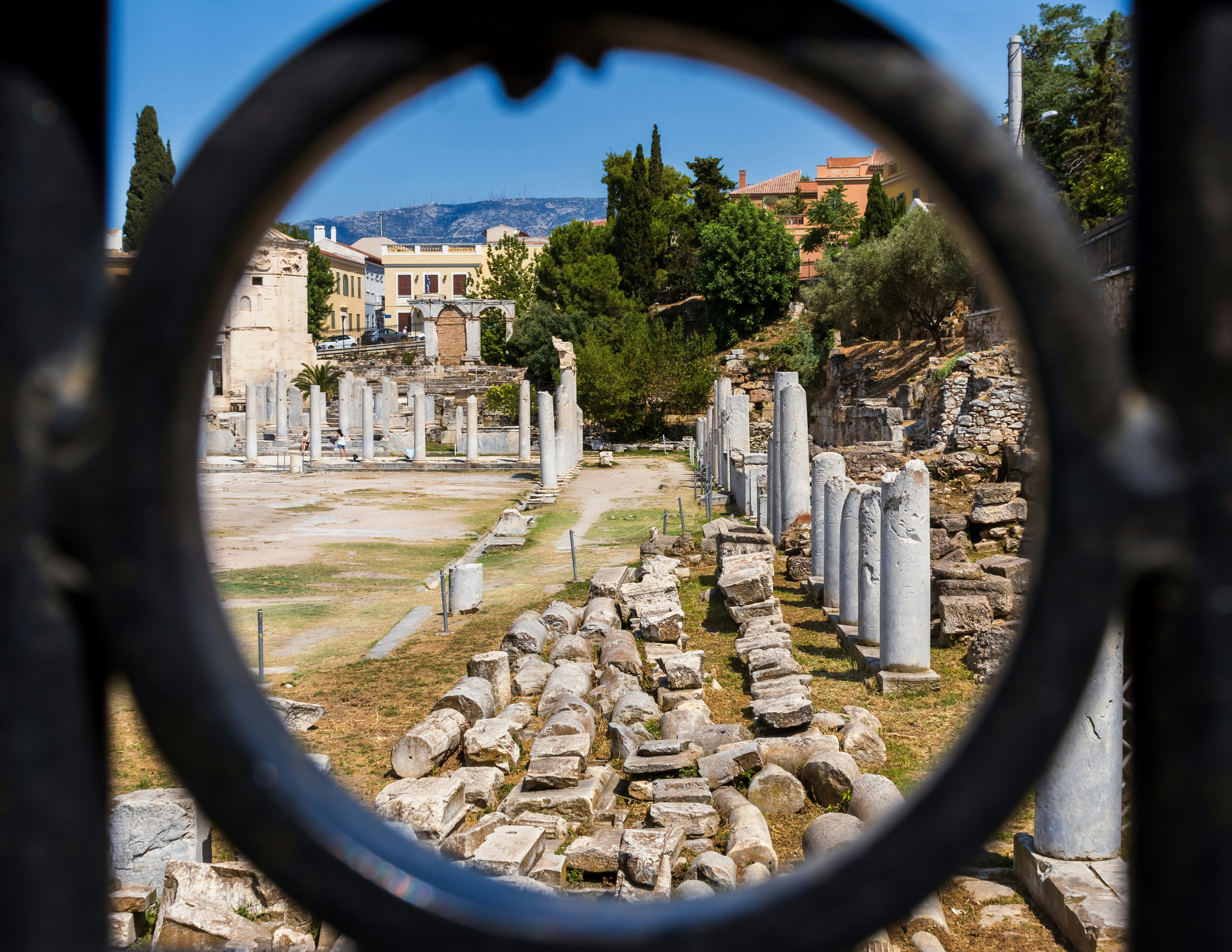 A close up of a magnifying glass looking at a cemetery