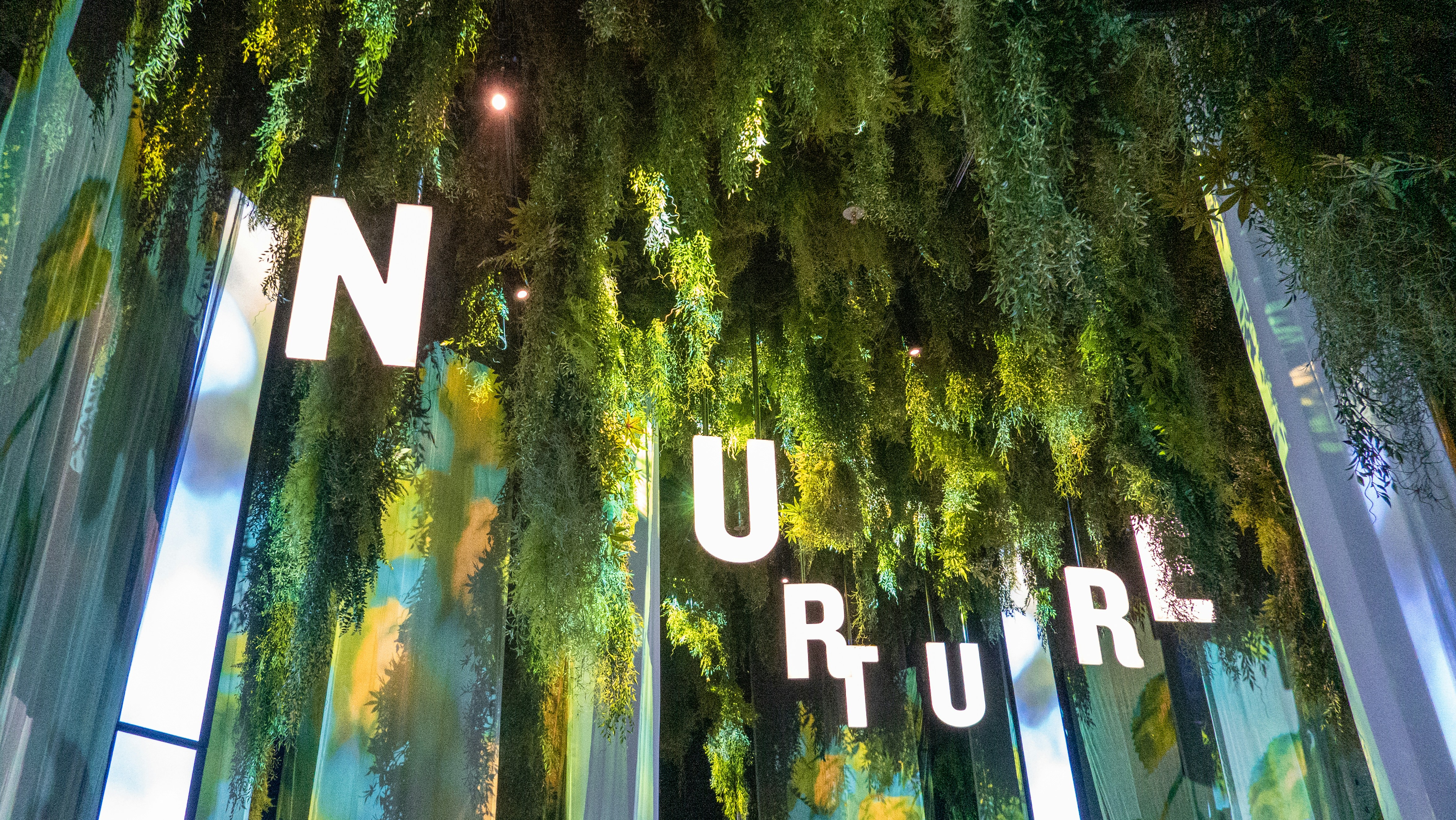 Vertical Garden Letters: A Cascade of Neon N Through Green Façade