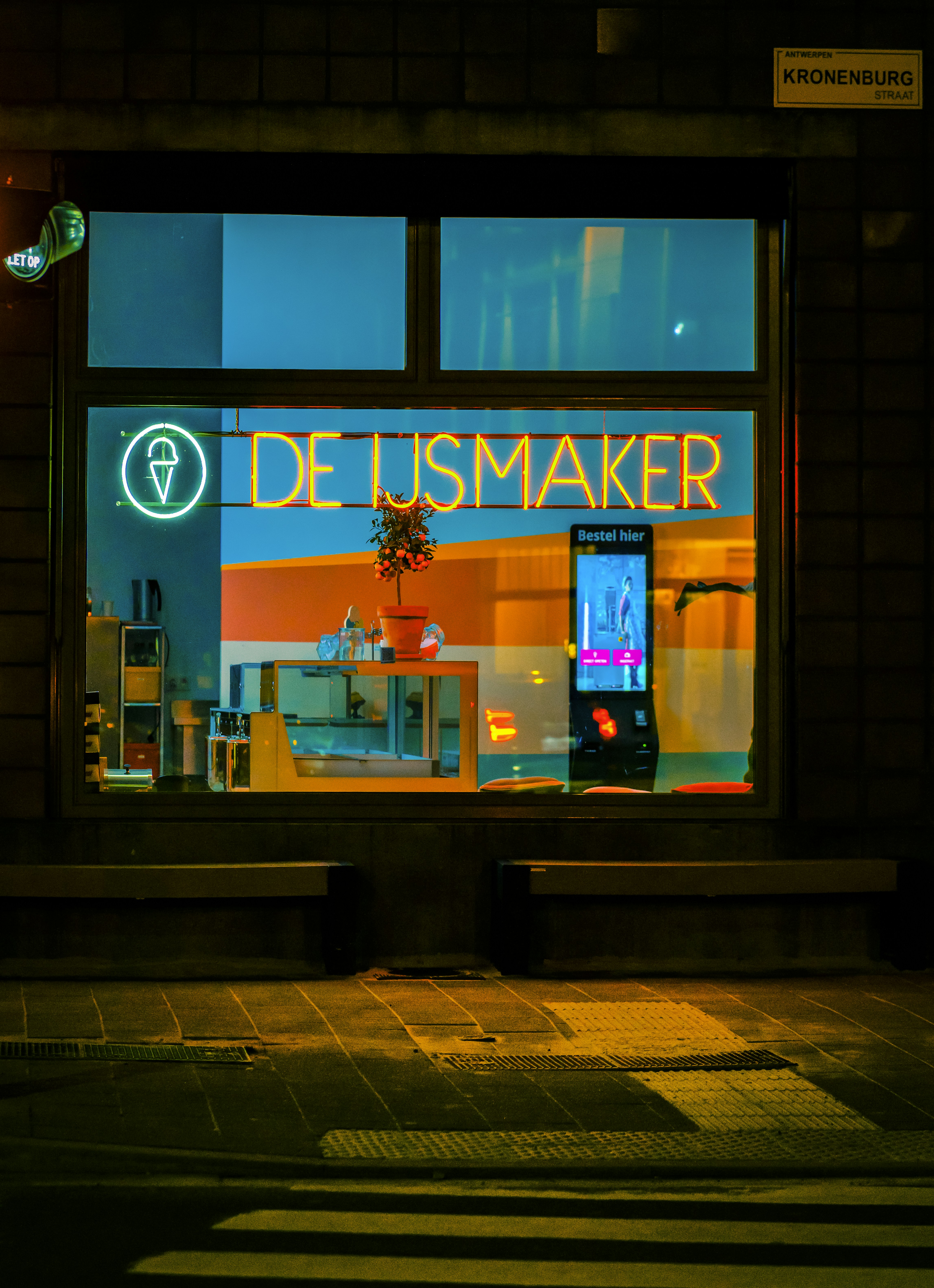 A store front at night with the lights on photo – Free Travel Image on ...