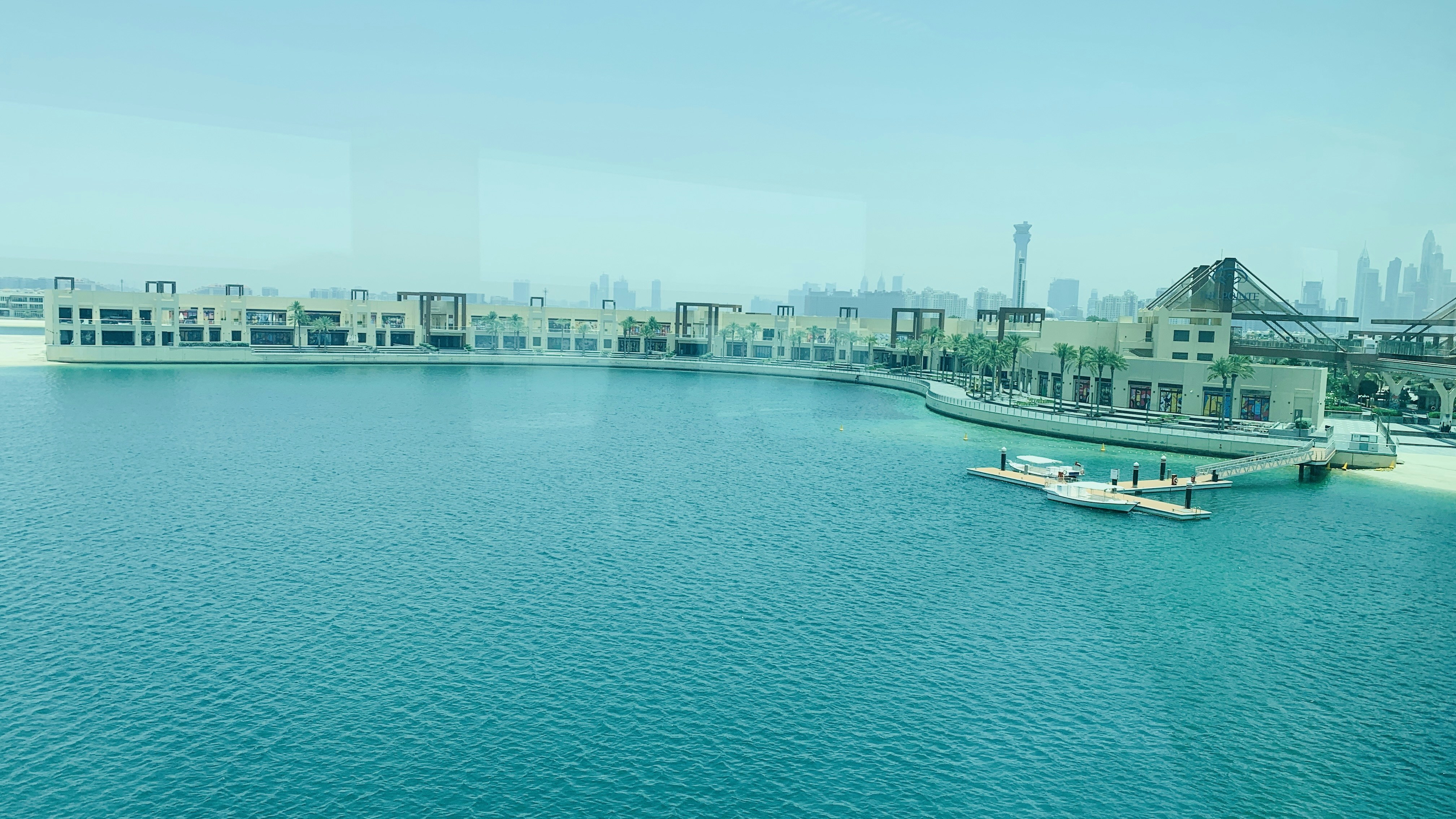 Azure Harbor Curve: A Tranquil Marina Framing the Distant Skyline