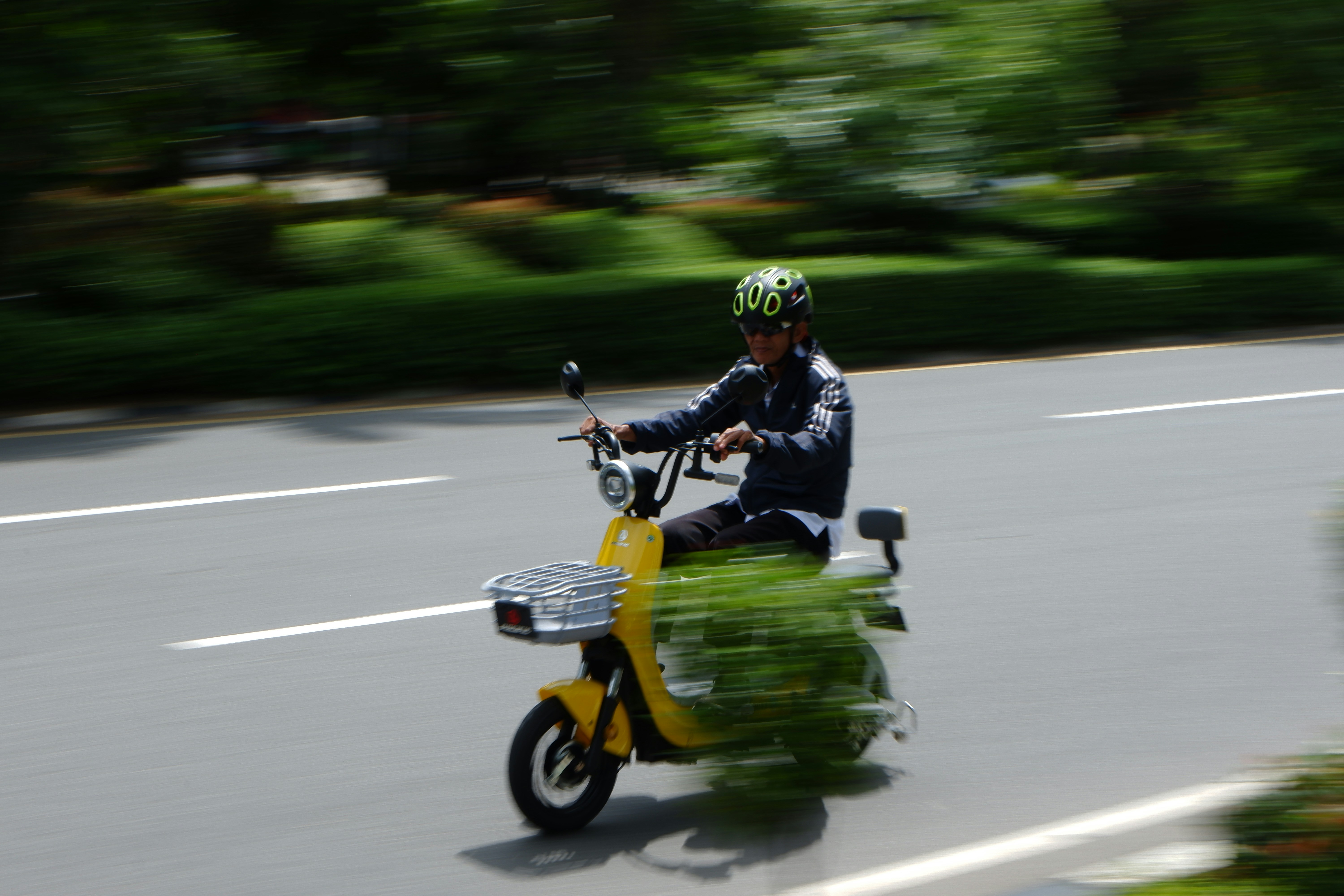 Blurred Breeze: Motorcyclist in Motion