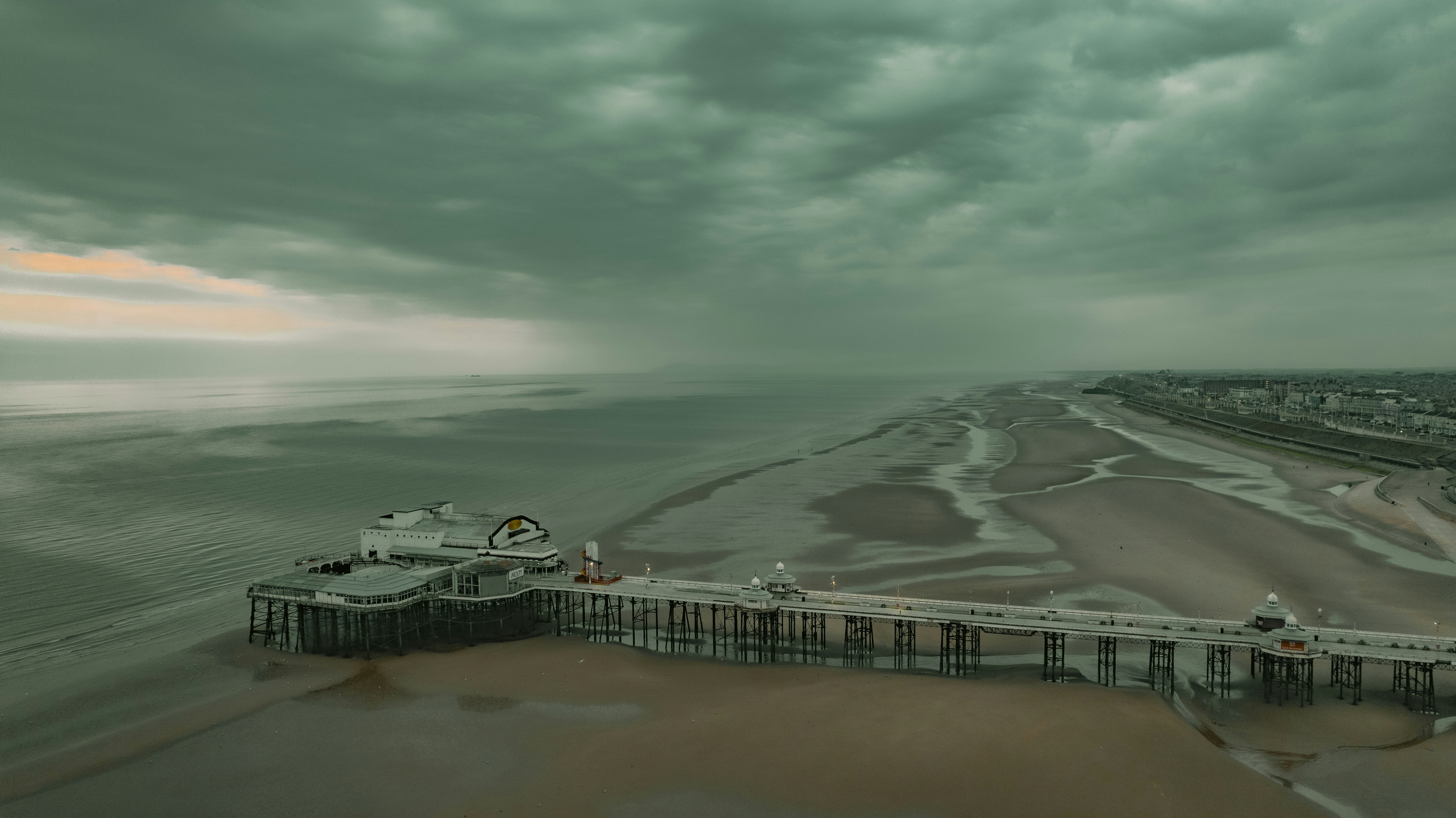 A long pier on a beach under a cloudy sky photo – Free Blackpool tower ...