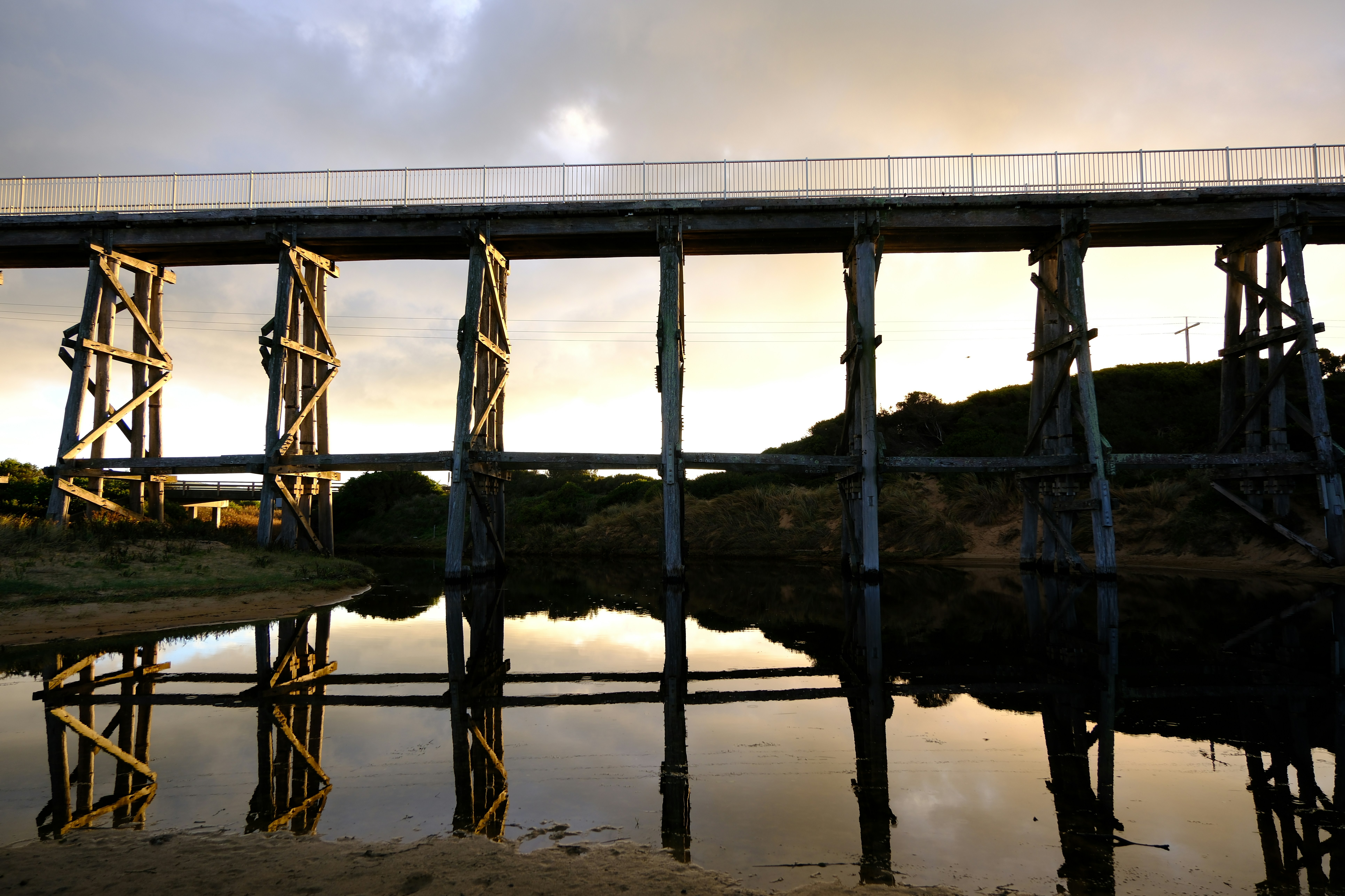 Timber Span at Dusk: Reflections on a Quiet Bridge