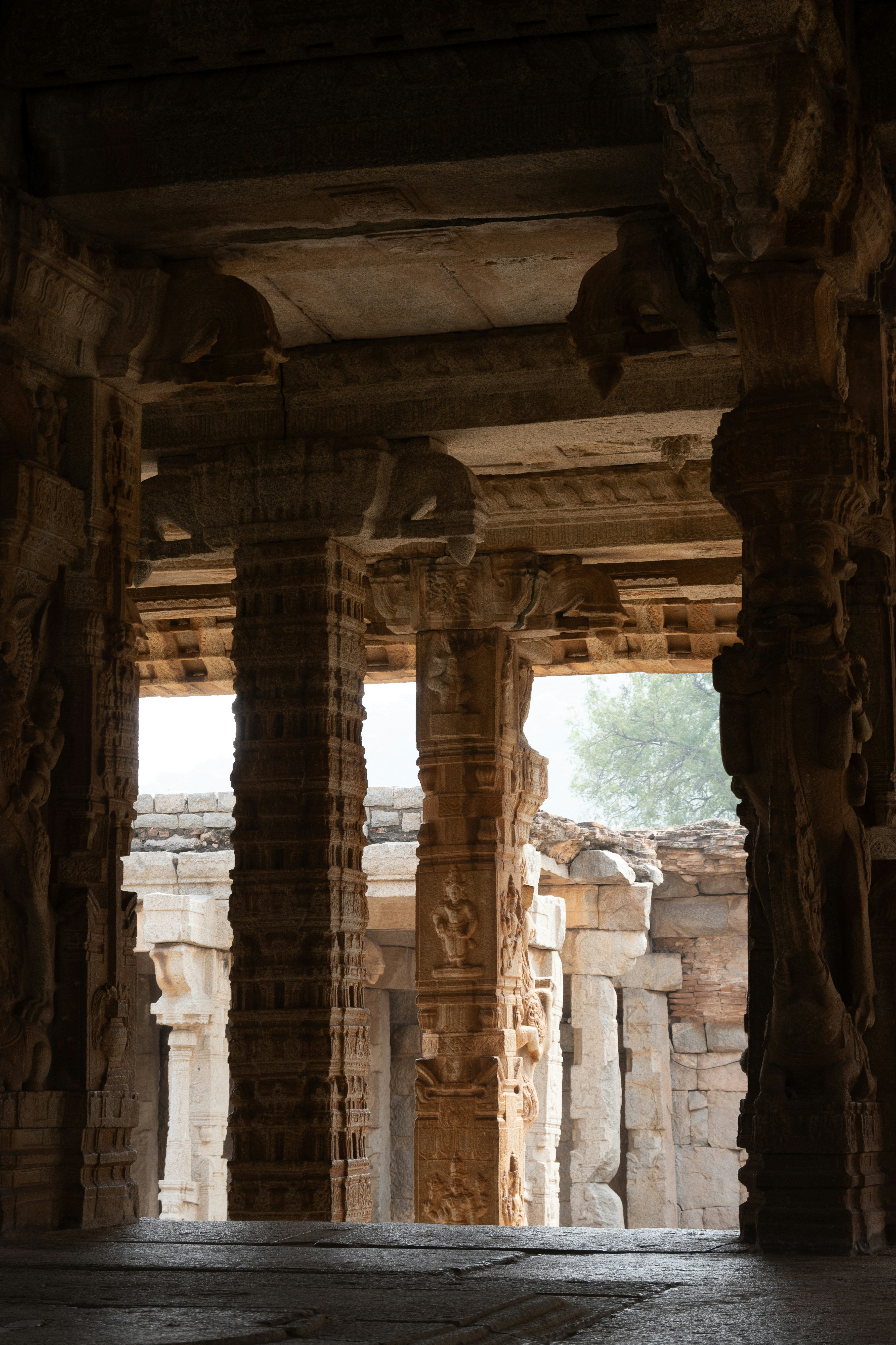A view of the inside of a building with columns photo – Free Hampi ...
