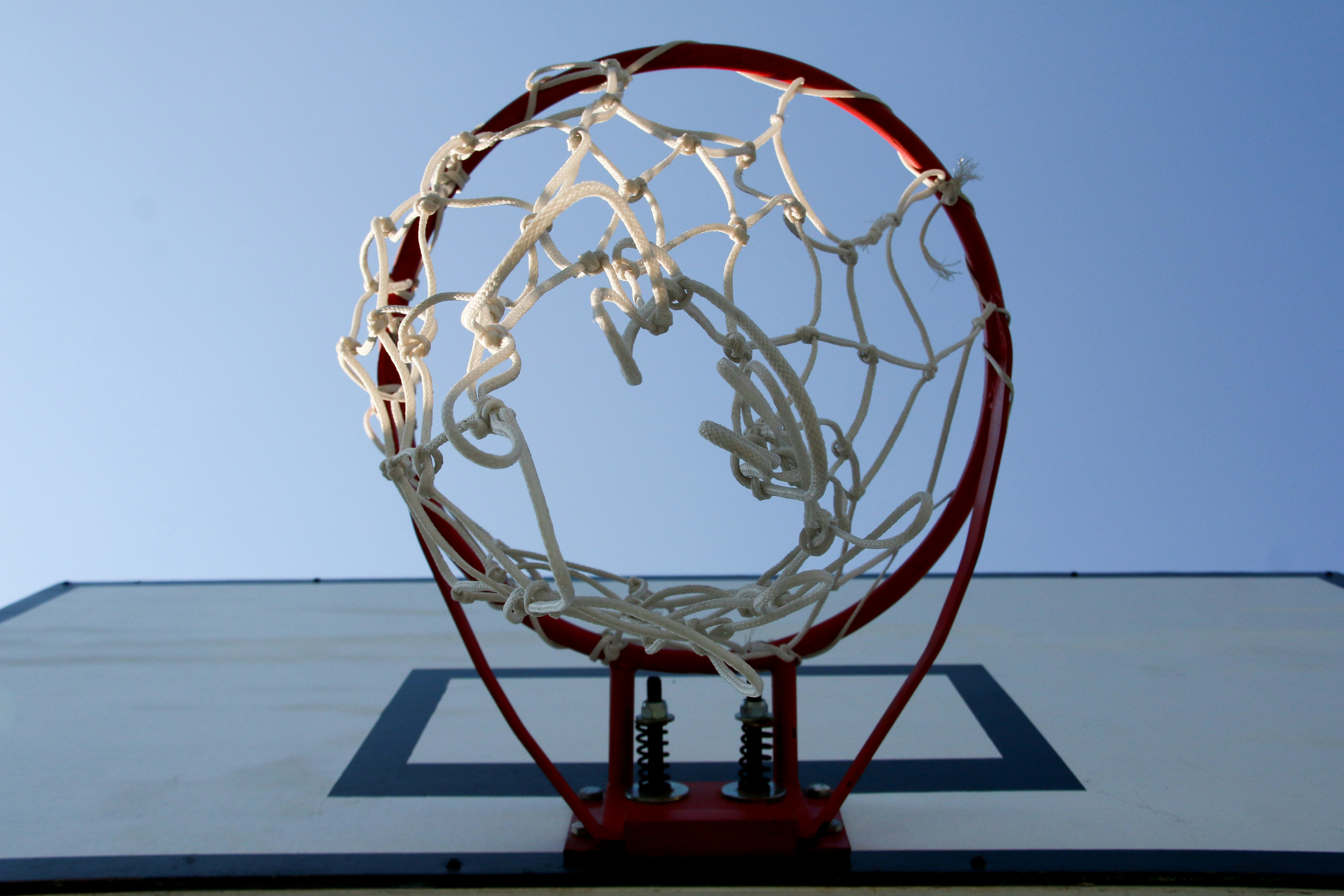A basketball hoop with a basketball inside of it photo – Free ...