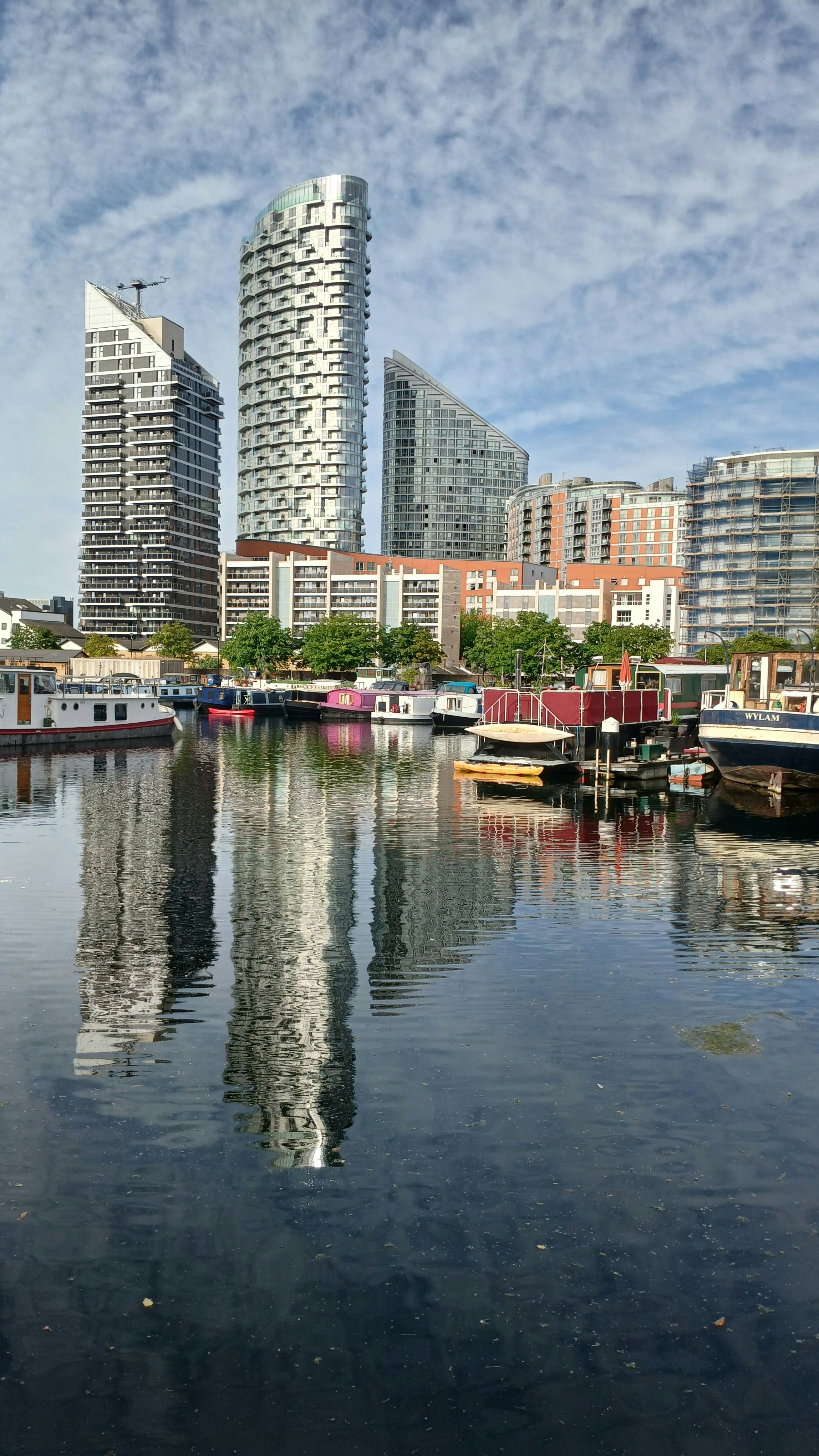 A harbor filled with lots of boats next to tall buildings photo – Free ...