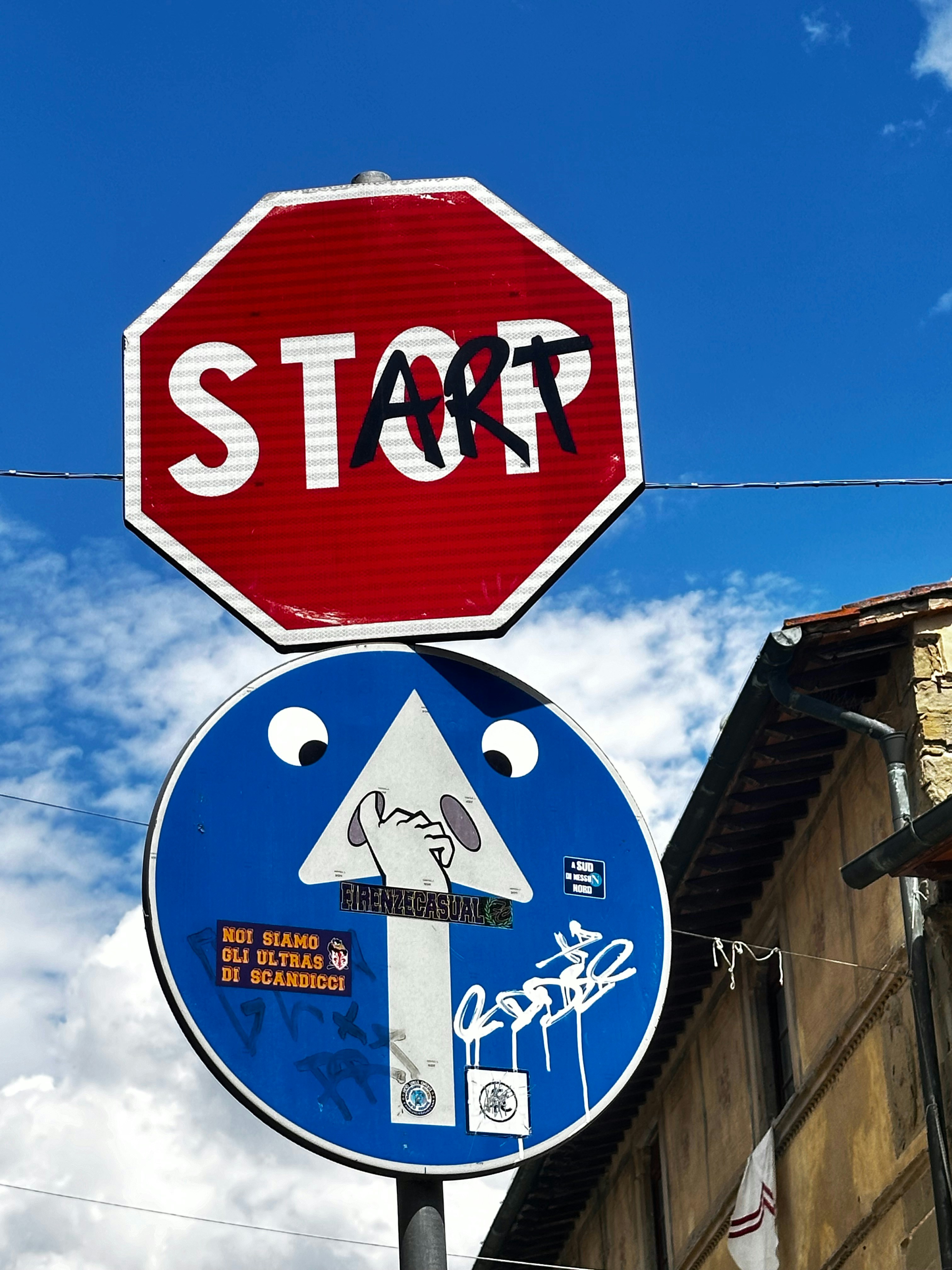 A red stop sign sitting above a blue street sign photo – Free Italy ...