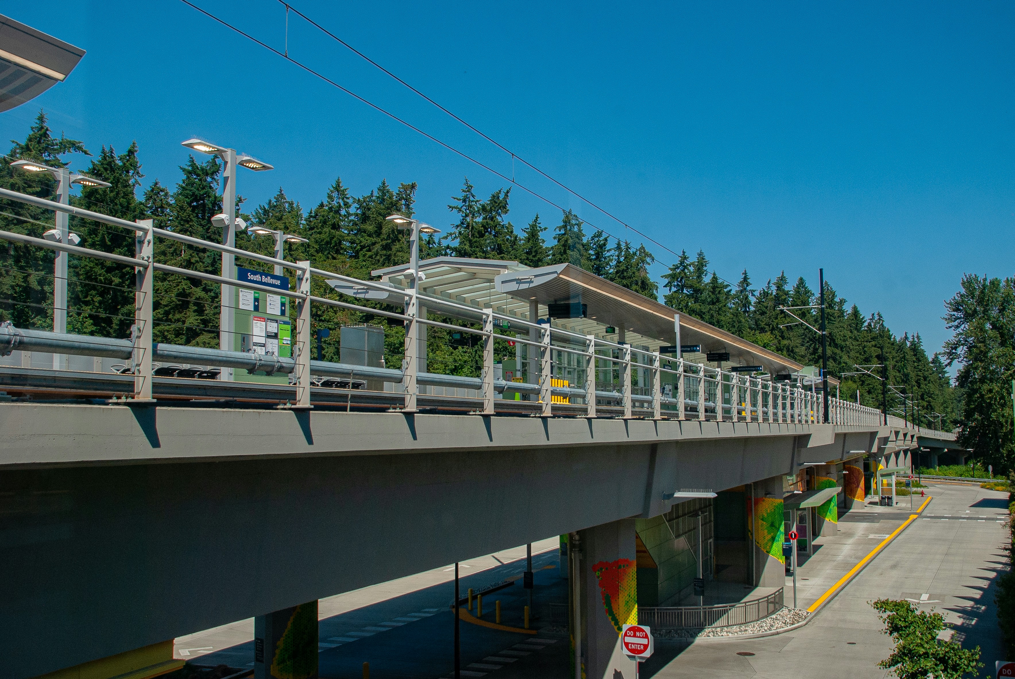 Sunlit Rails: The Quiet Elevation of a Painted Transit Bridge