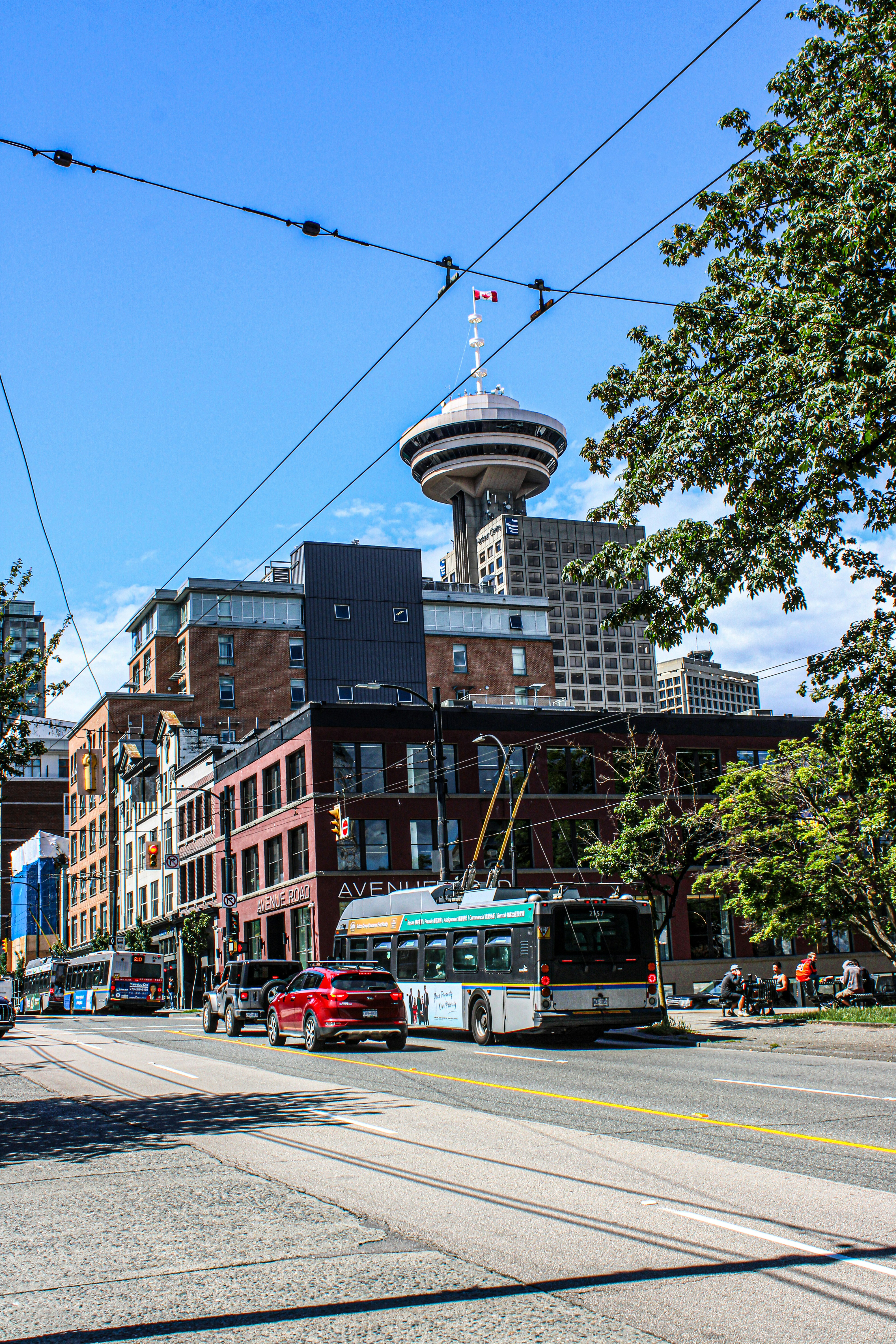 Circular Watchtower Looms Over a Tram-Threaded City Street