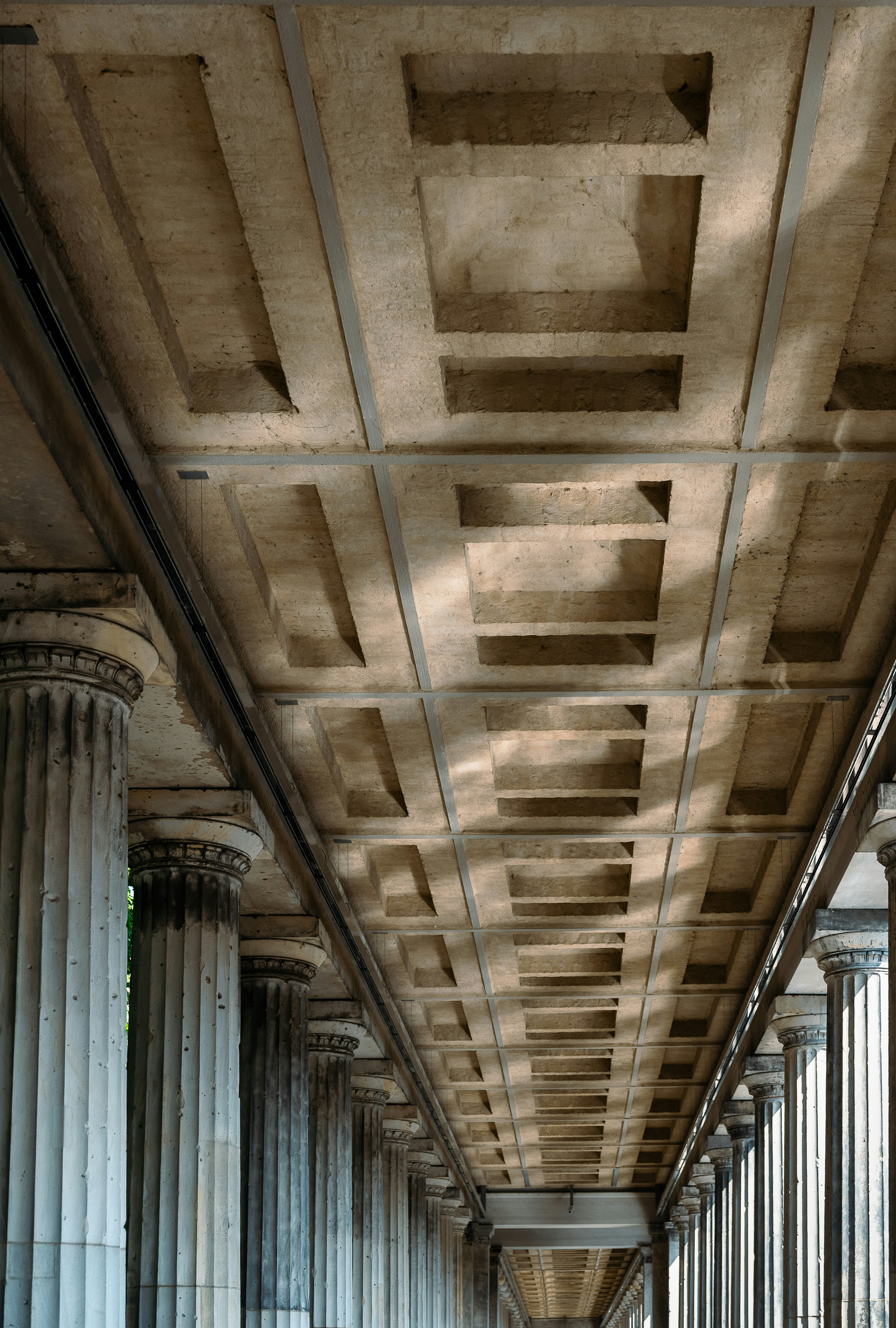 A row of columns under a bridge next to a sidewalk photo – Free Berlin ...