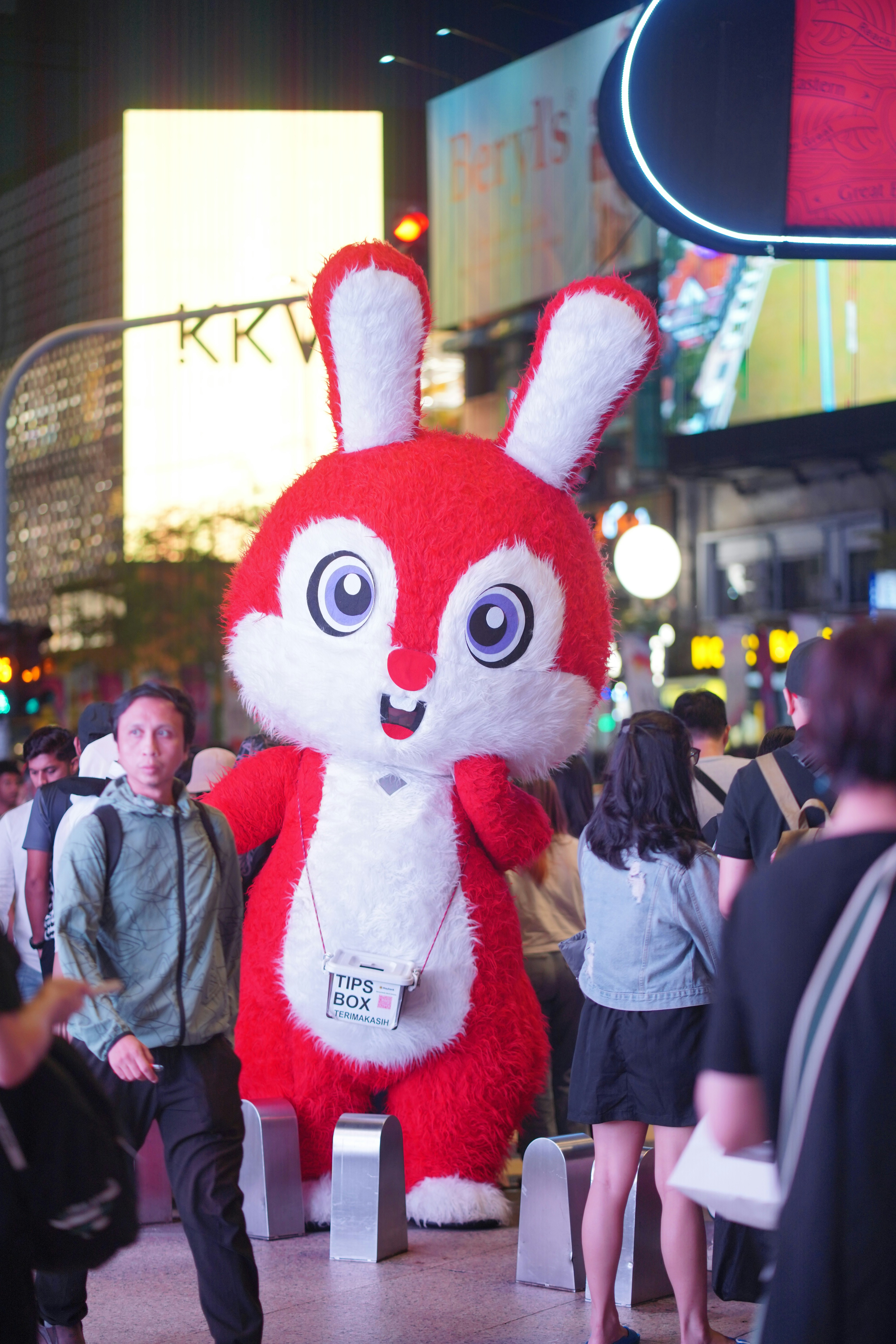 City Stroll with a Giant Red Mascot