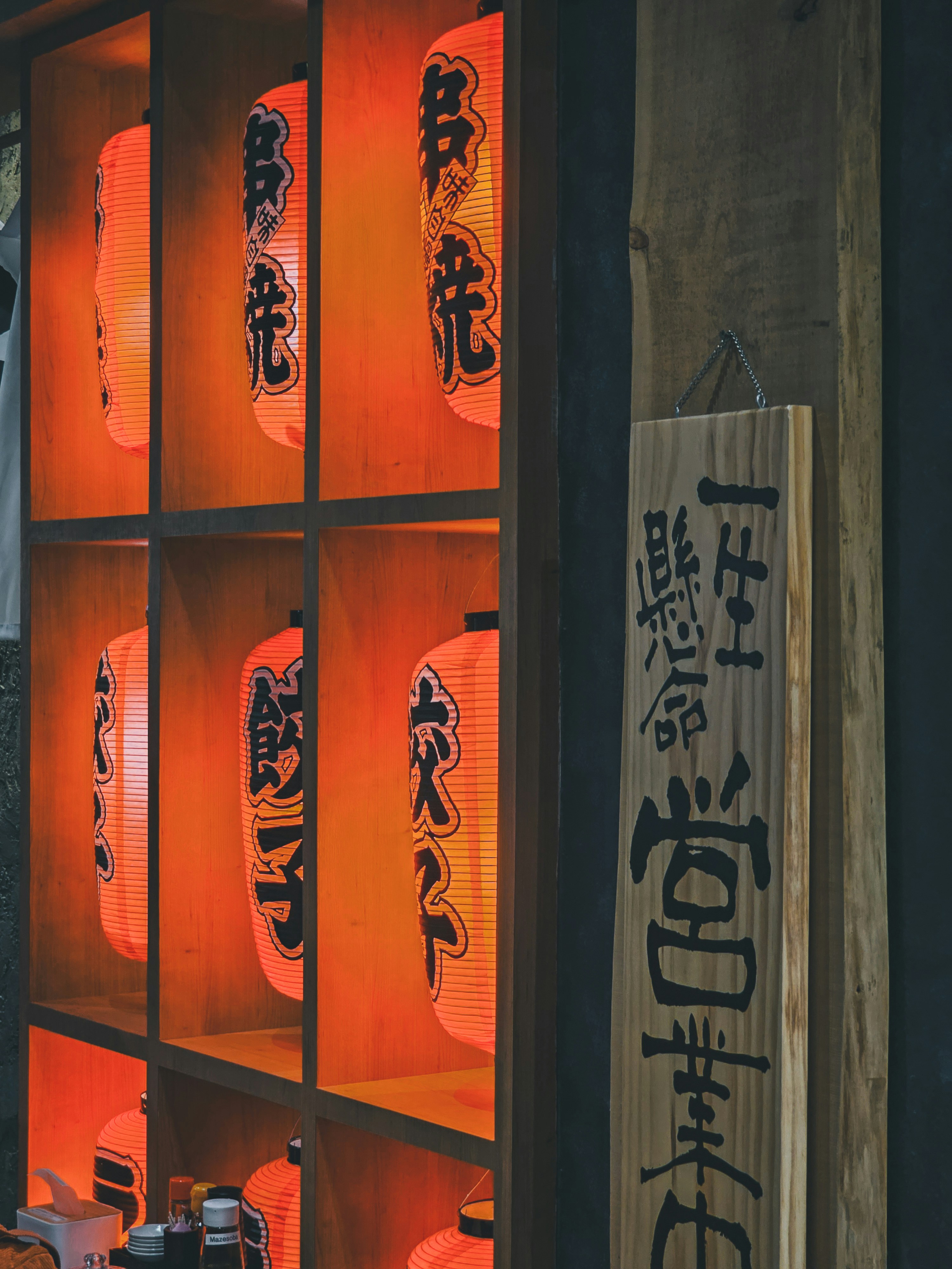 A display case filled with lots of orange lanterns photo – Free ...