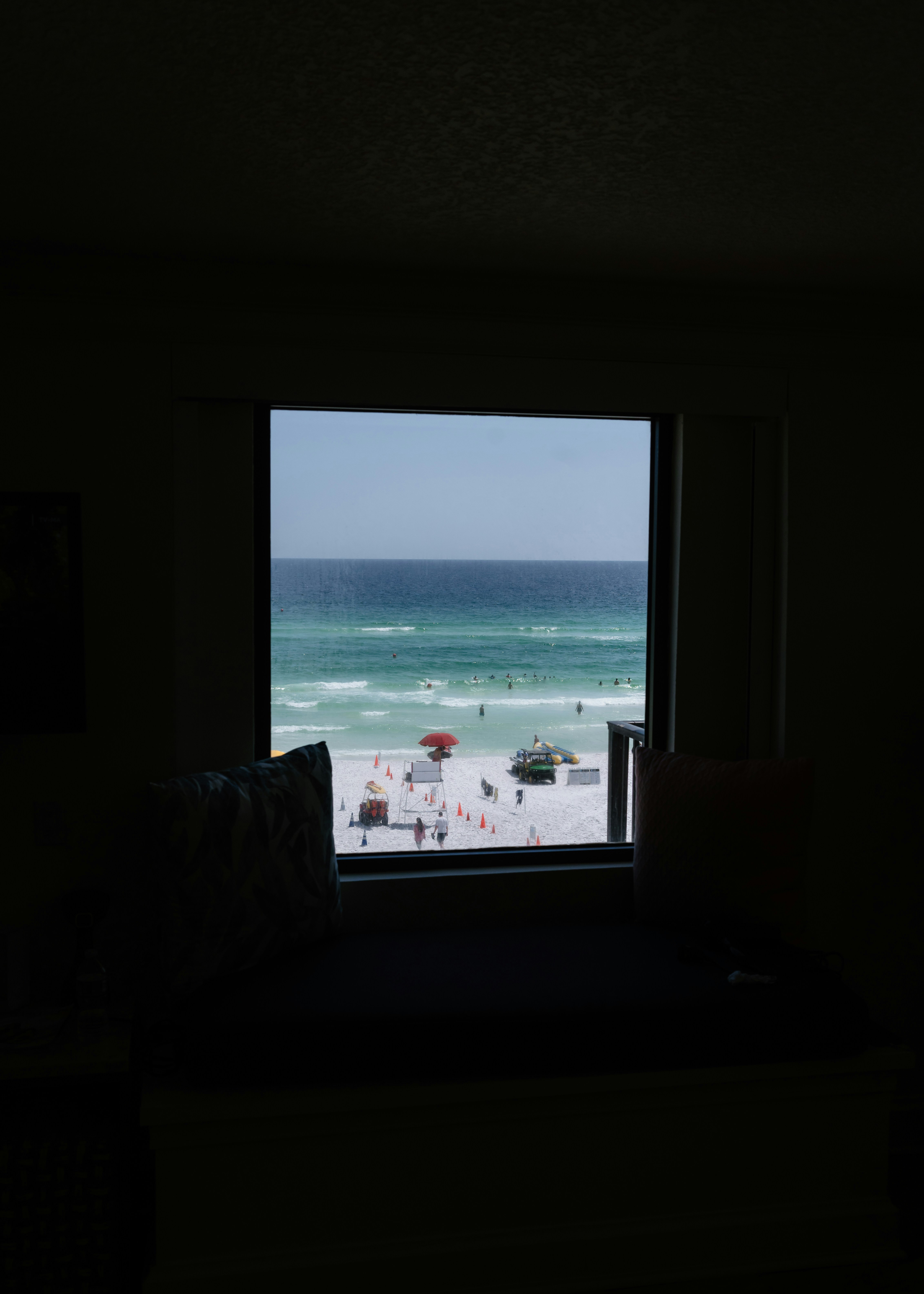 A view of a beach through a window photo – Free Building Image on Unsplash