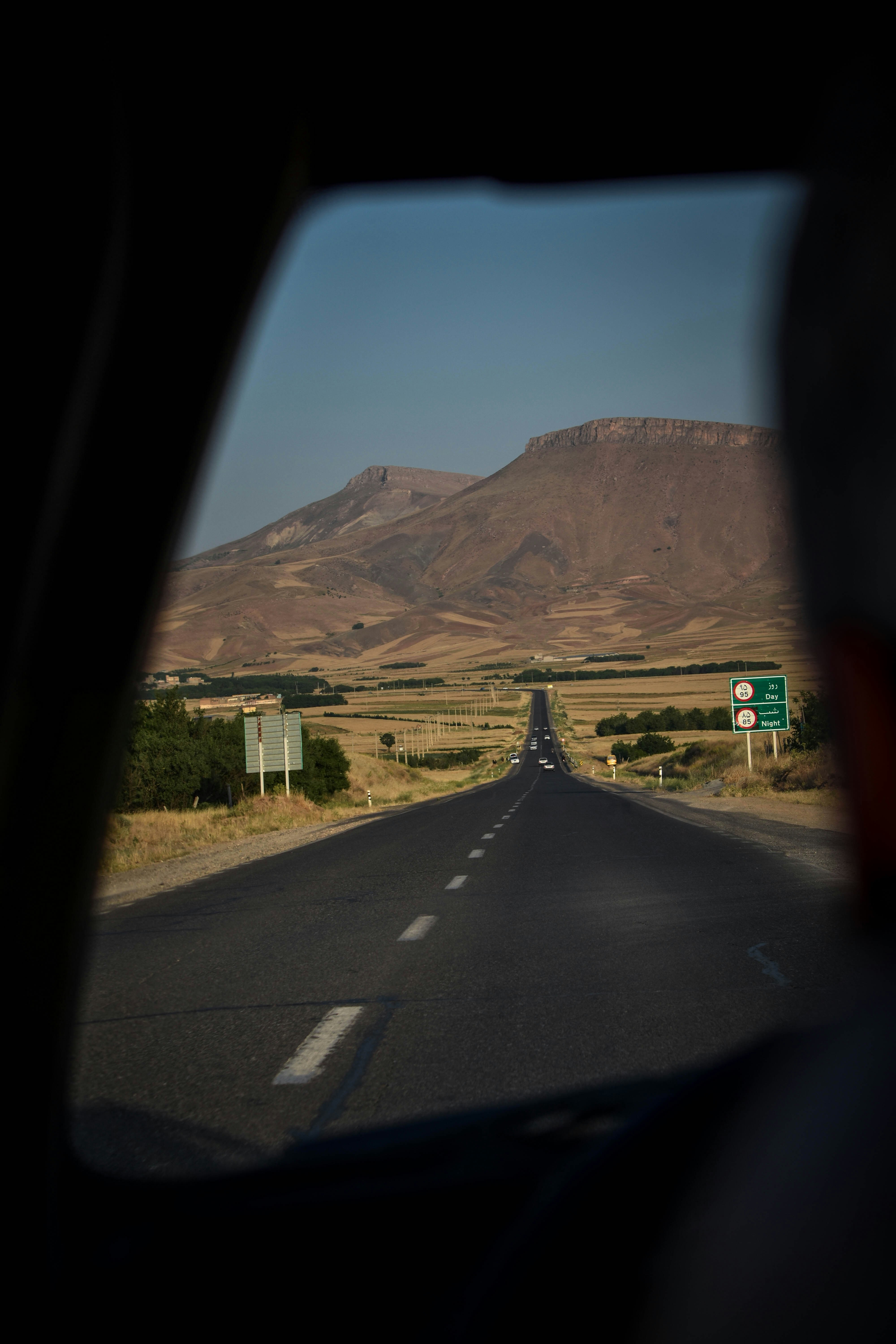 A view of a road through a car window photo – Free Nature Image on Unsplash