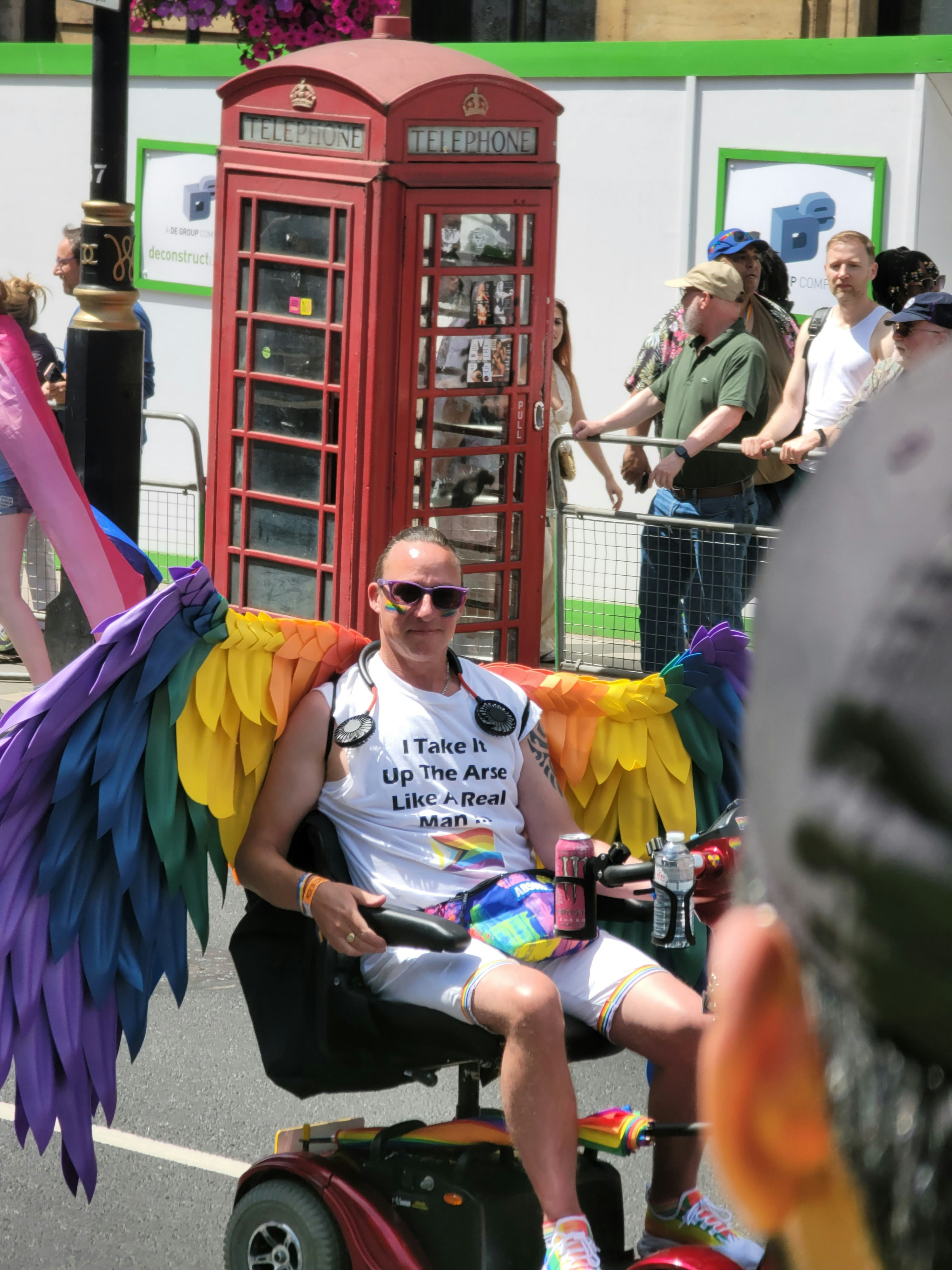 Rainbow Wings and Red Box: Pride Parade Moment at the London Street