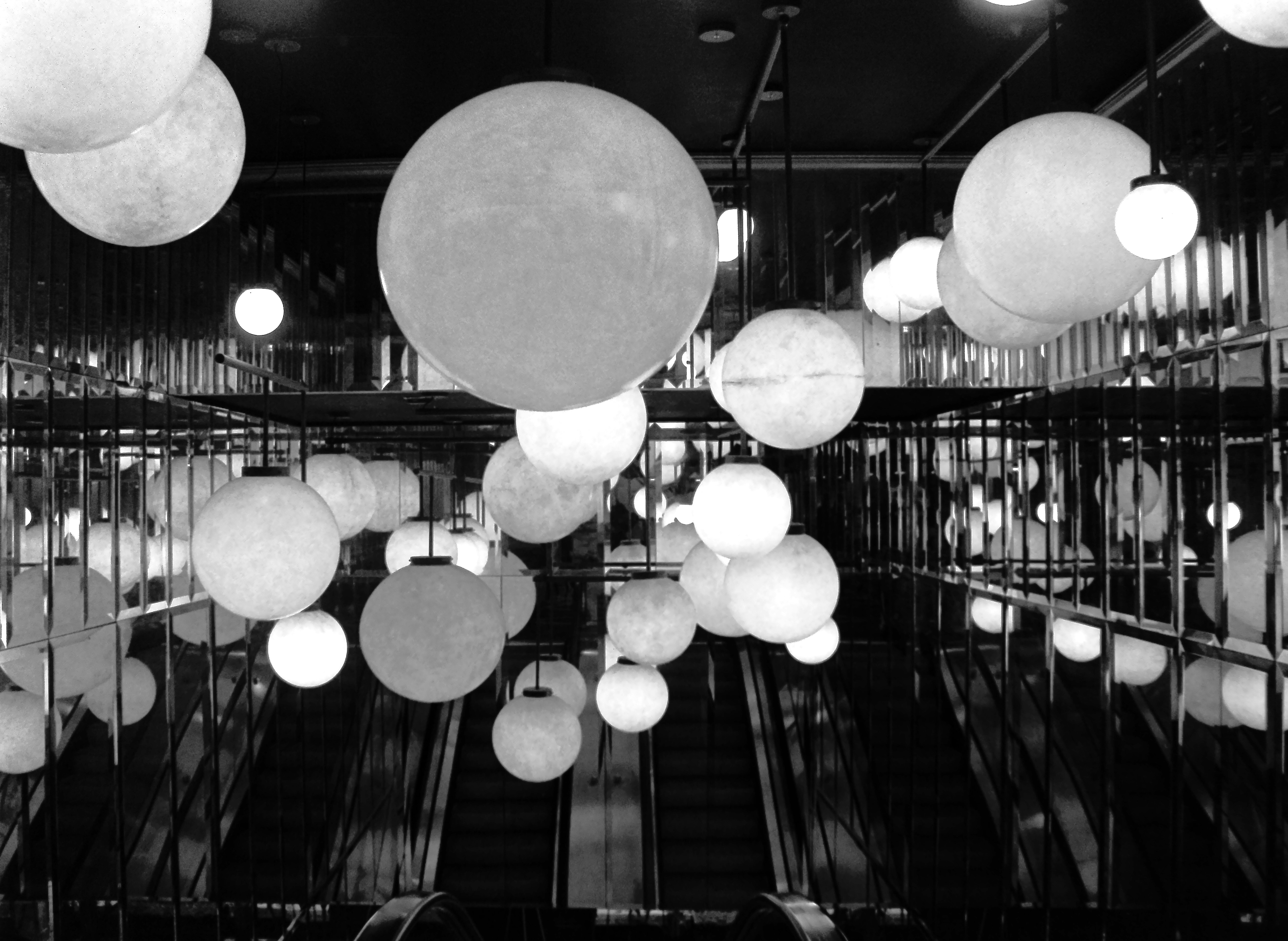 Monochrome Orbs: A Hanging Canopy Through Glass