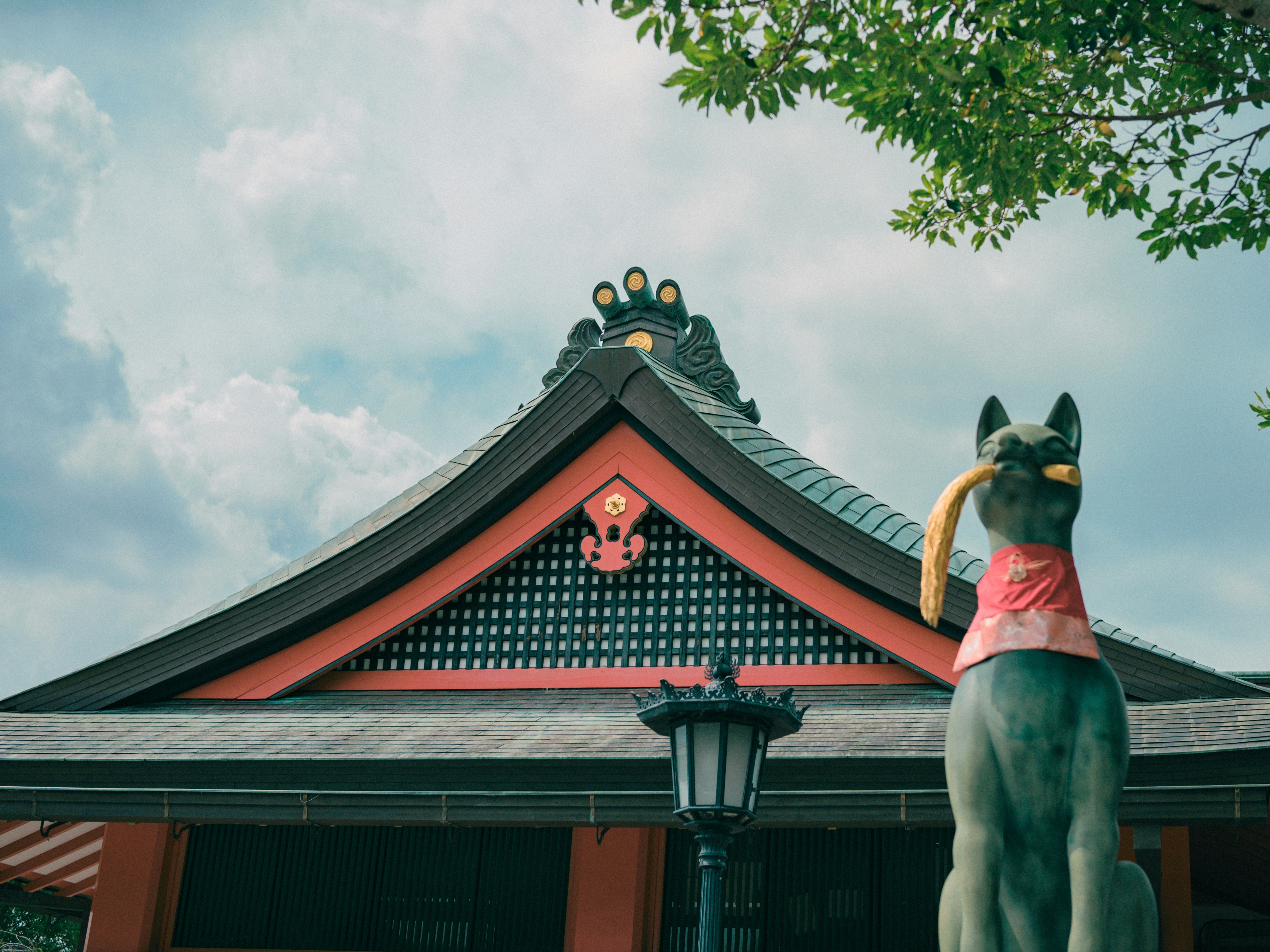 Guardians of the Shrine: A Neon-Red Roof and a Stately Izumi Dog