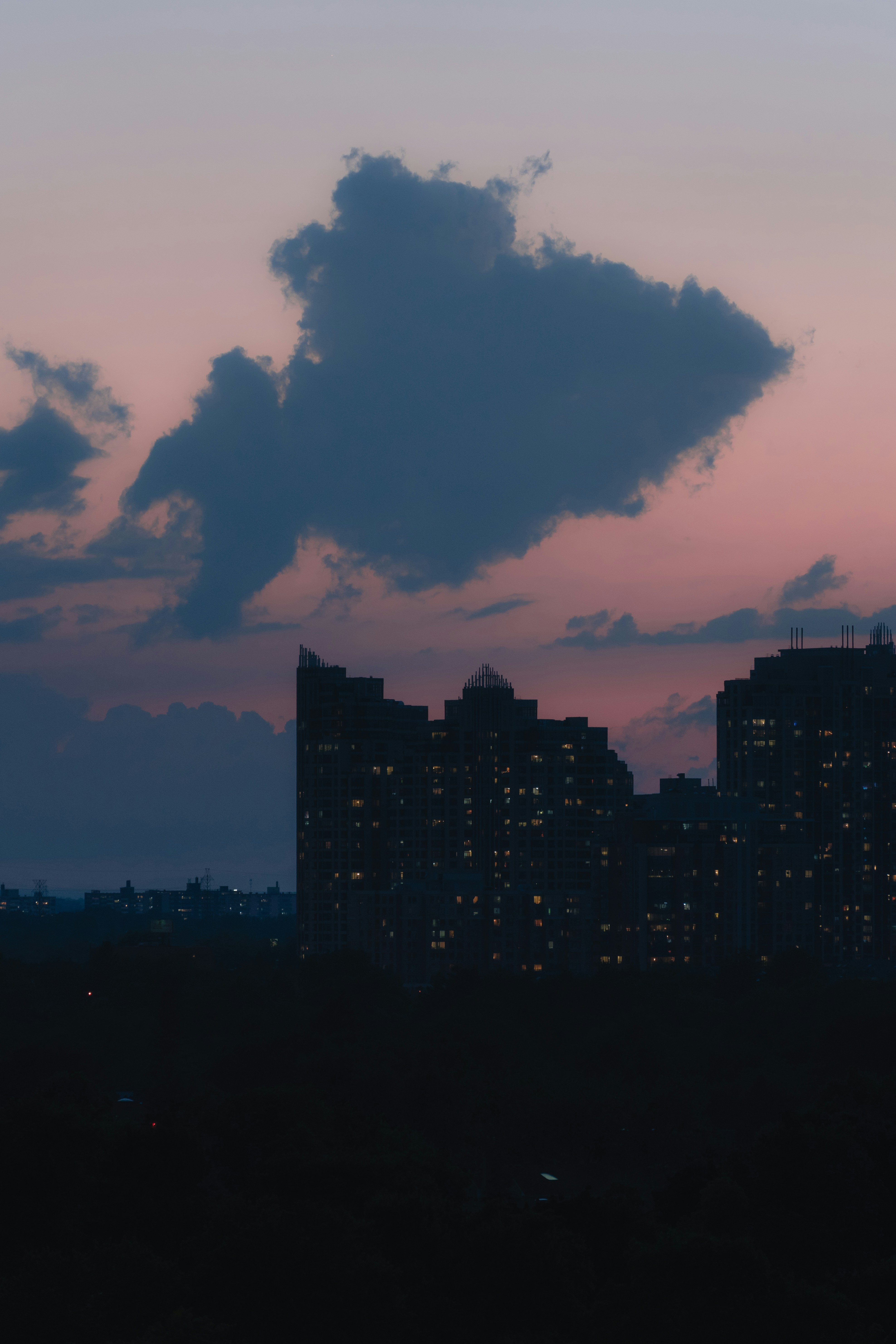 Cloud Crown Over a Twilight Cityscape