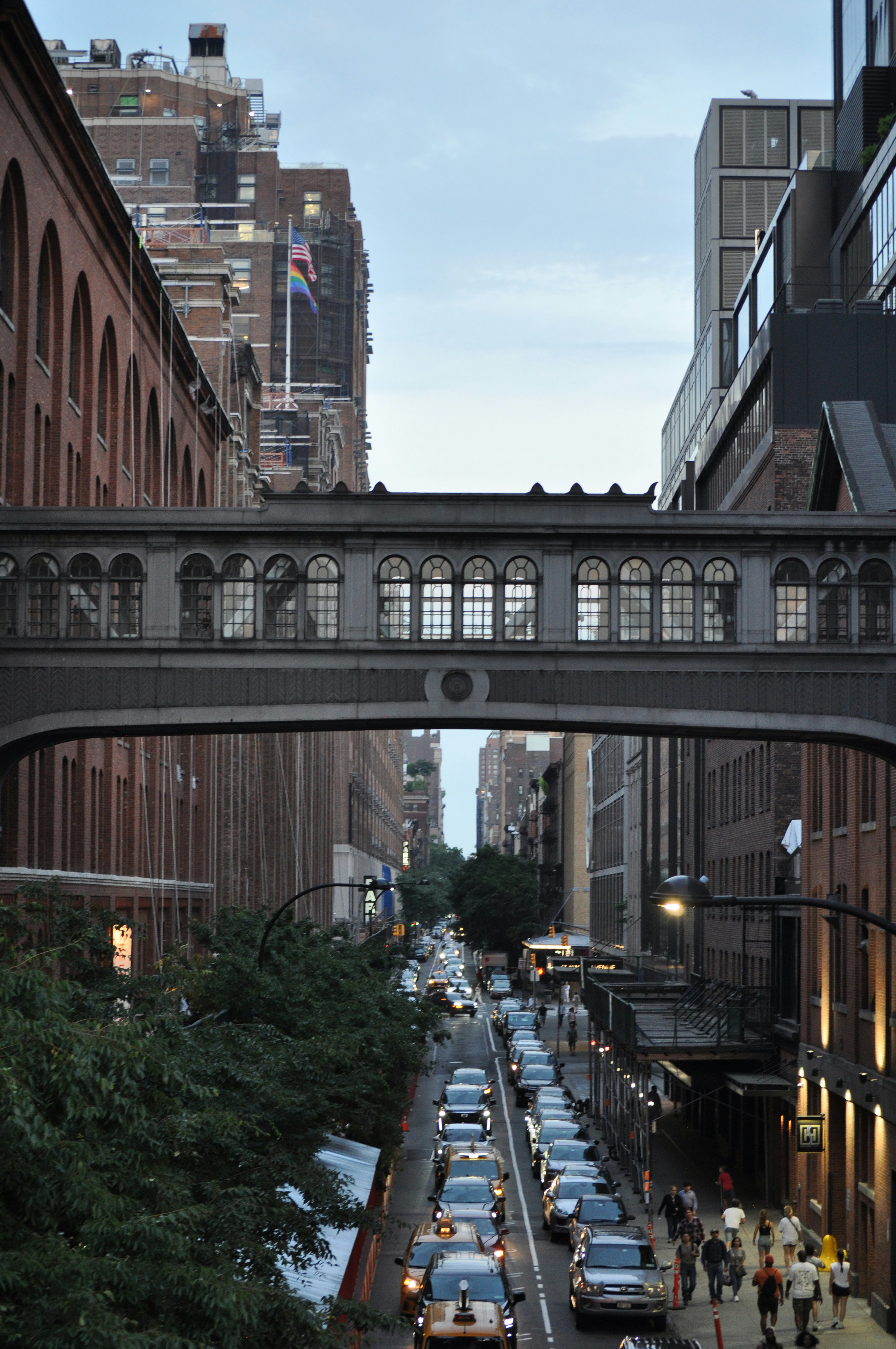 A city street filled with lots of traffic under a bridge photo – Free ...