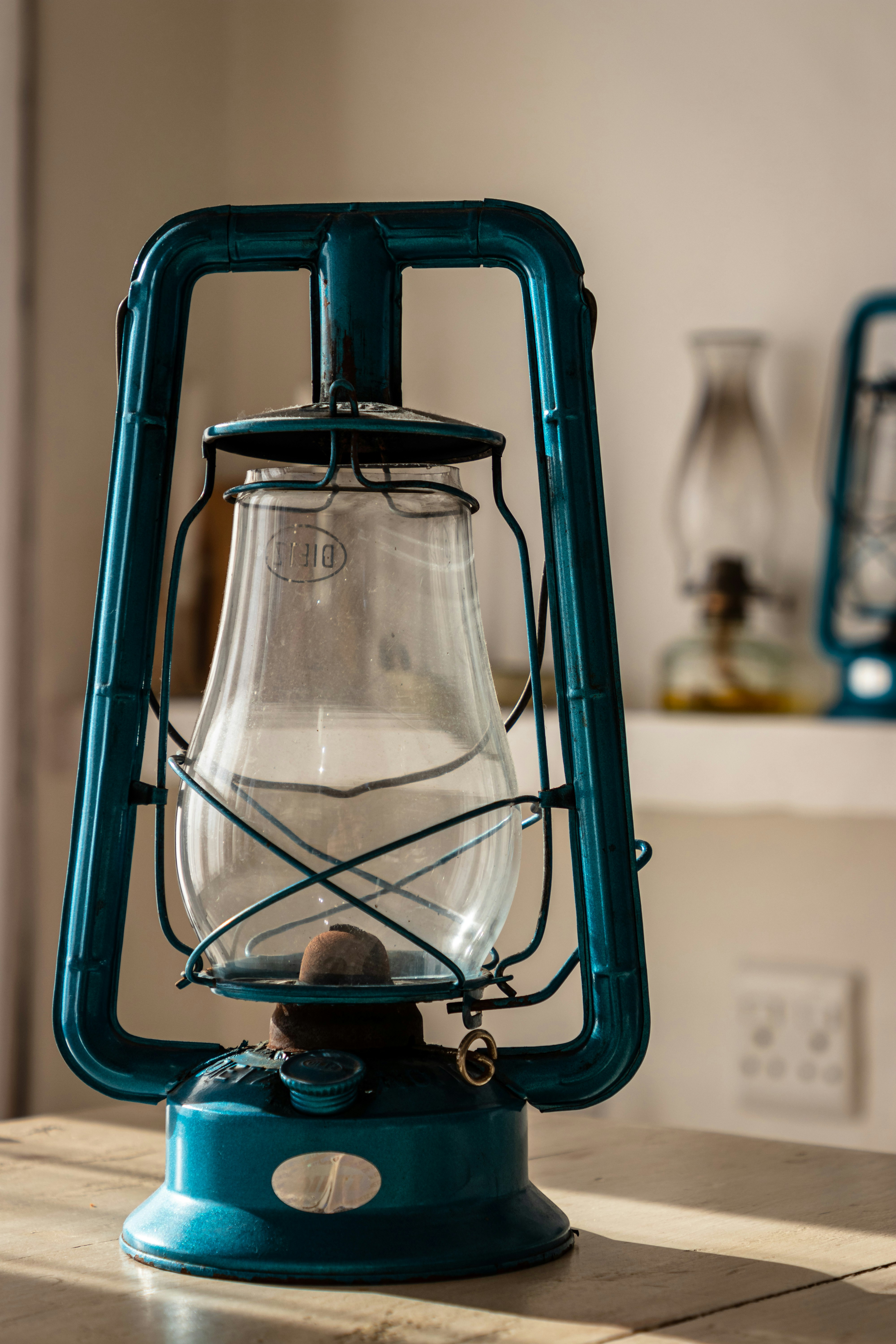 Teal Lantern Amid Quiet Kitchen Glow