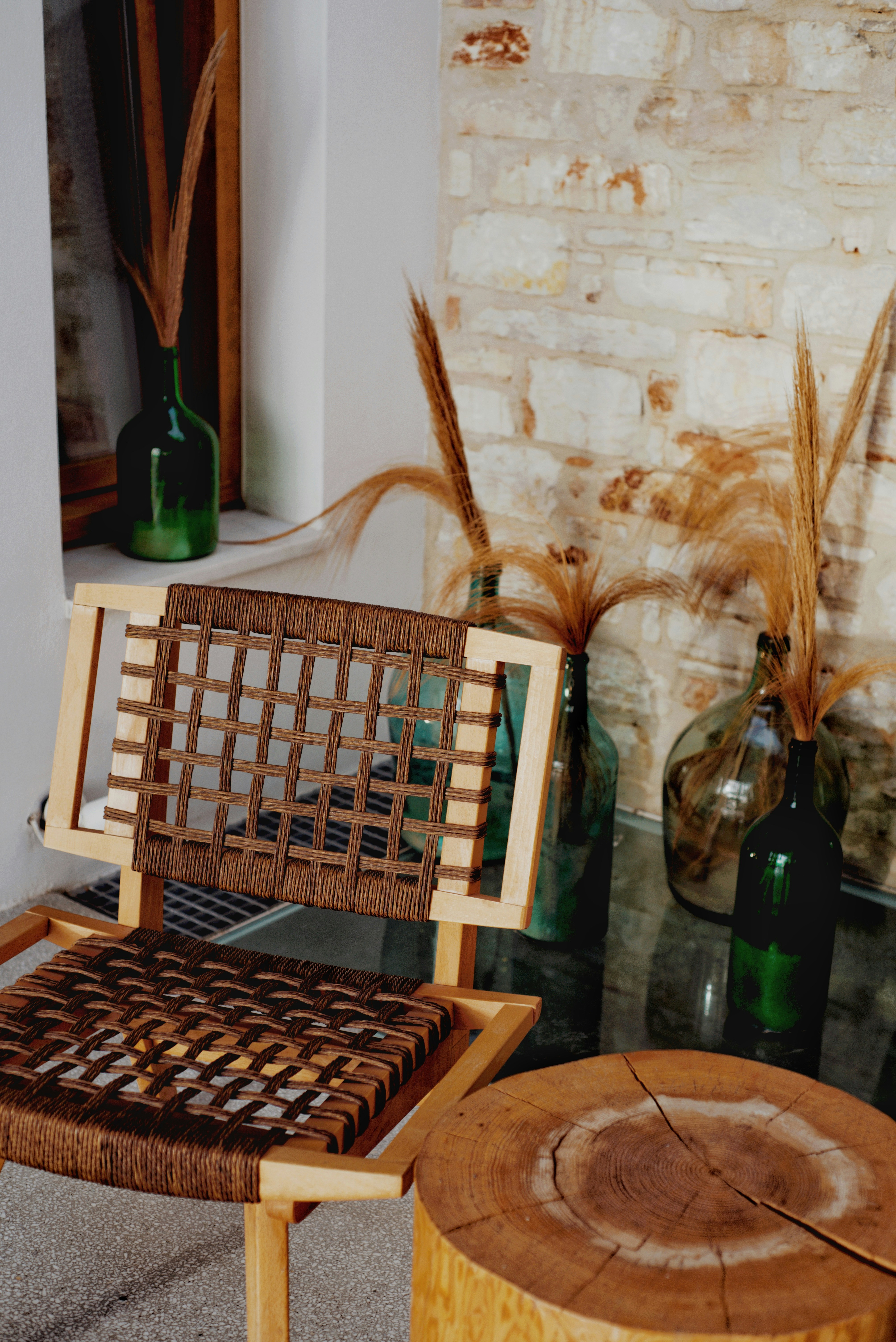 Woven Chairs and Amber Vases in a Sunlit Corner