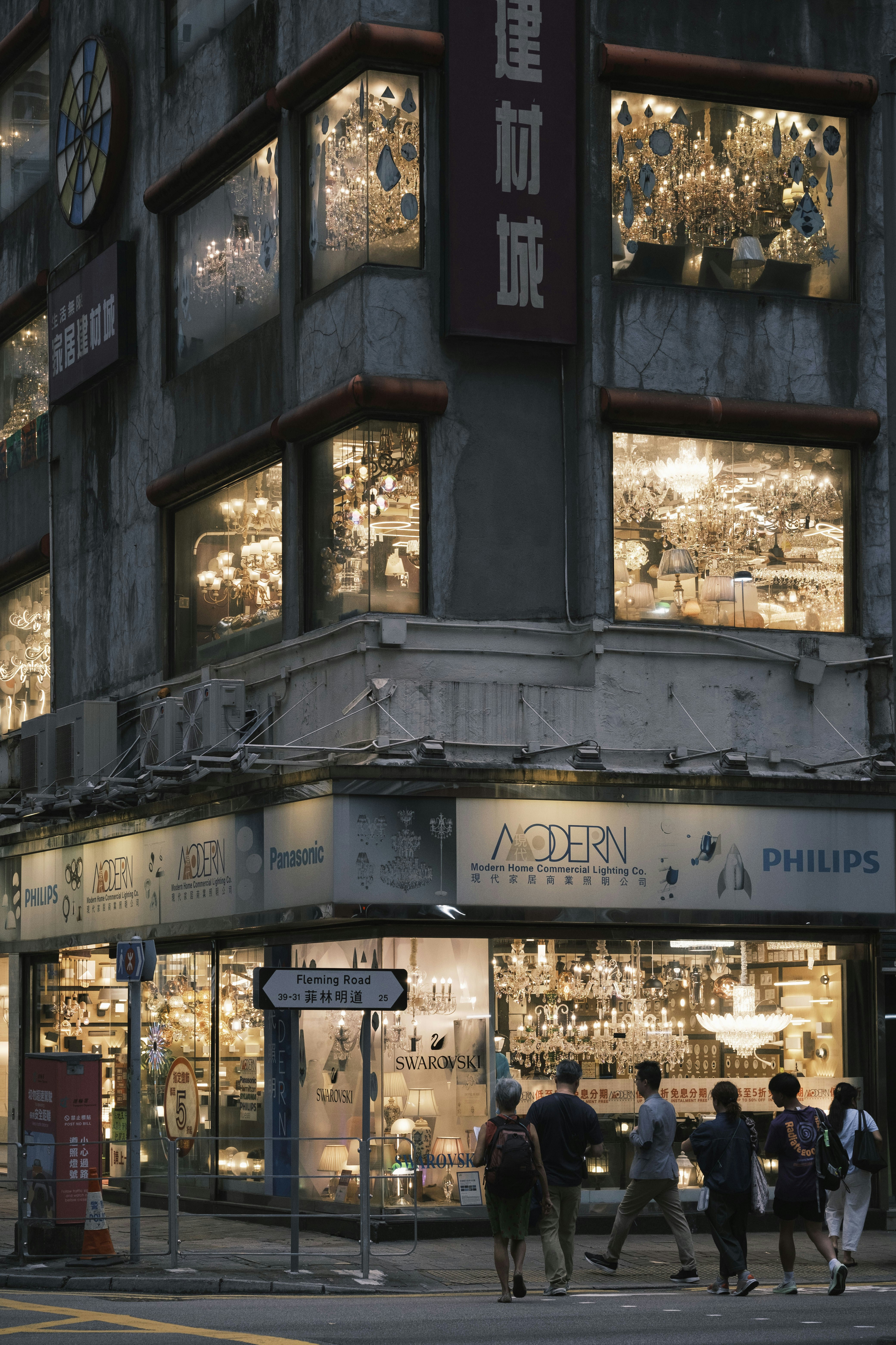 Corner of Glittering Showrooms: Chandeliers Illuminating a City Street