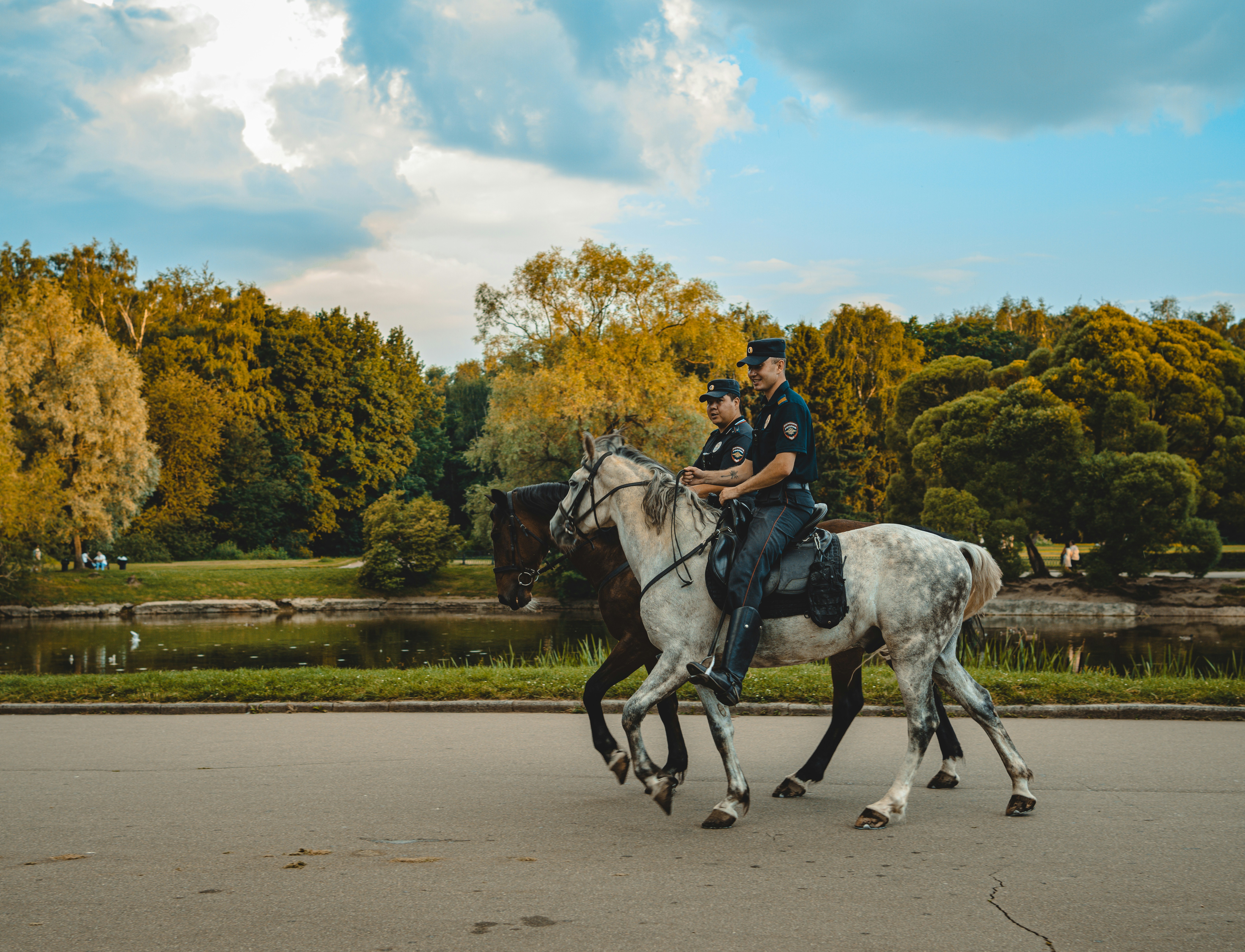 A couple of people riding on the backs of horses photo – Free Person ...