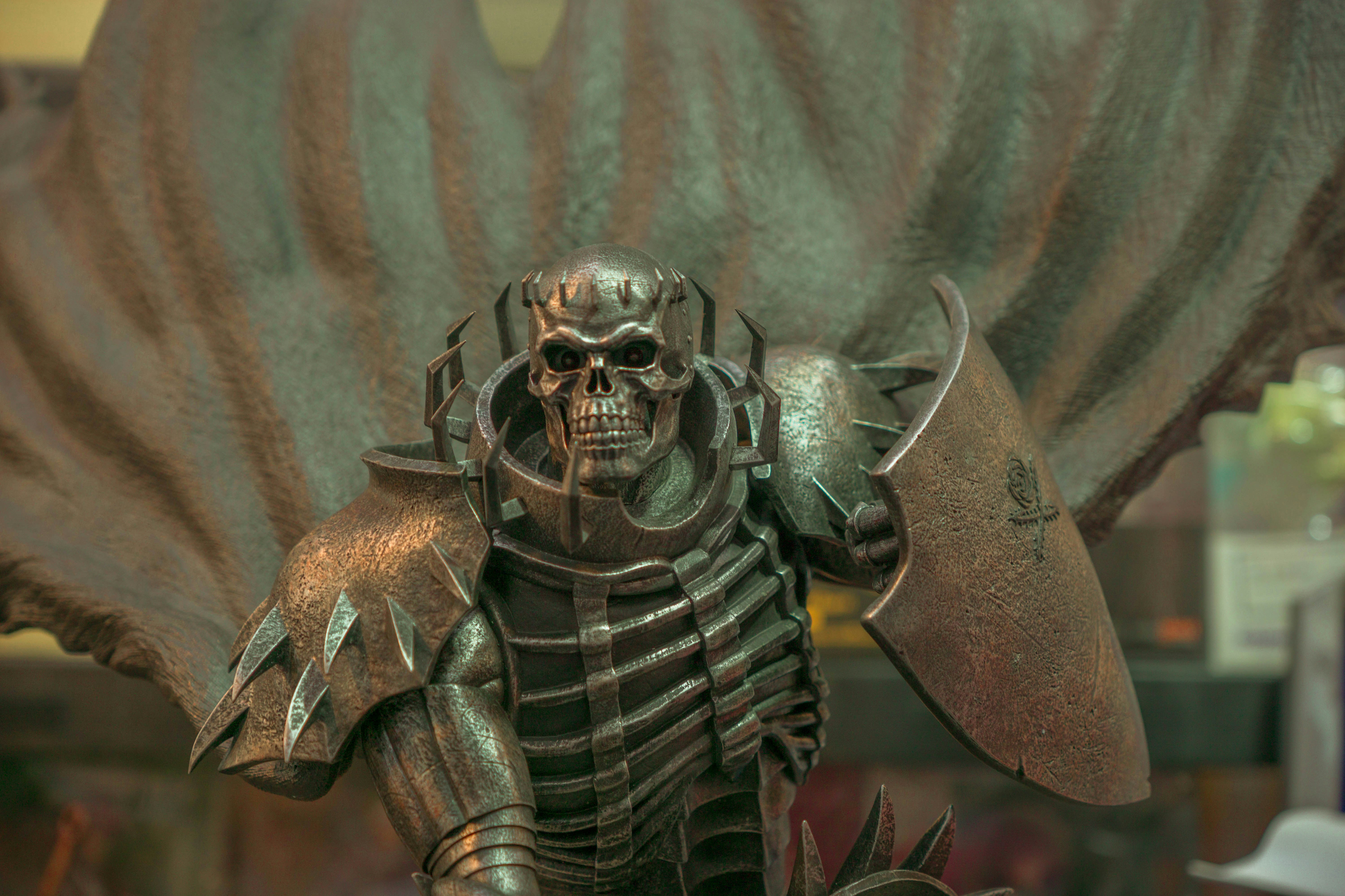 A statue of a skeleton holding a sword photo – Free Action figure Image ...