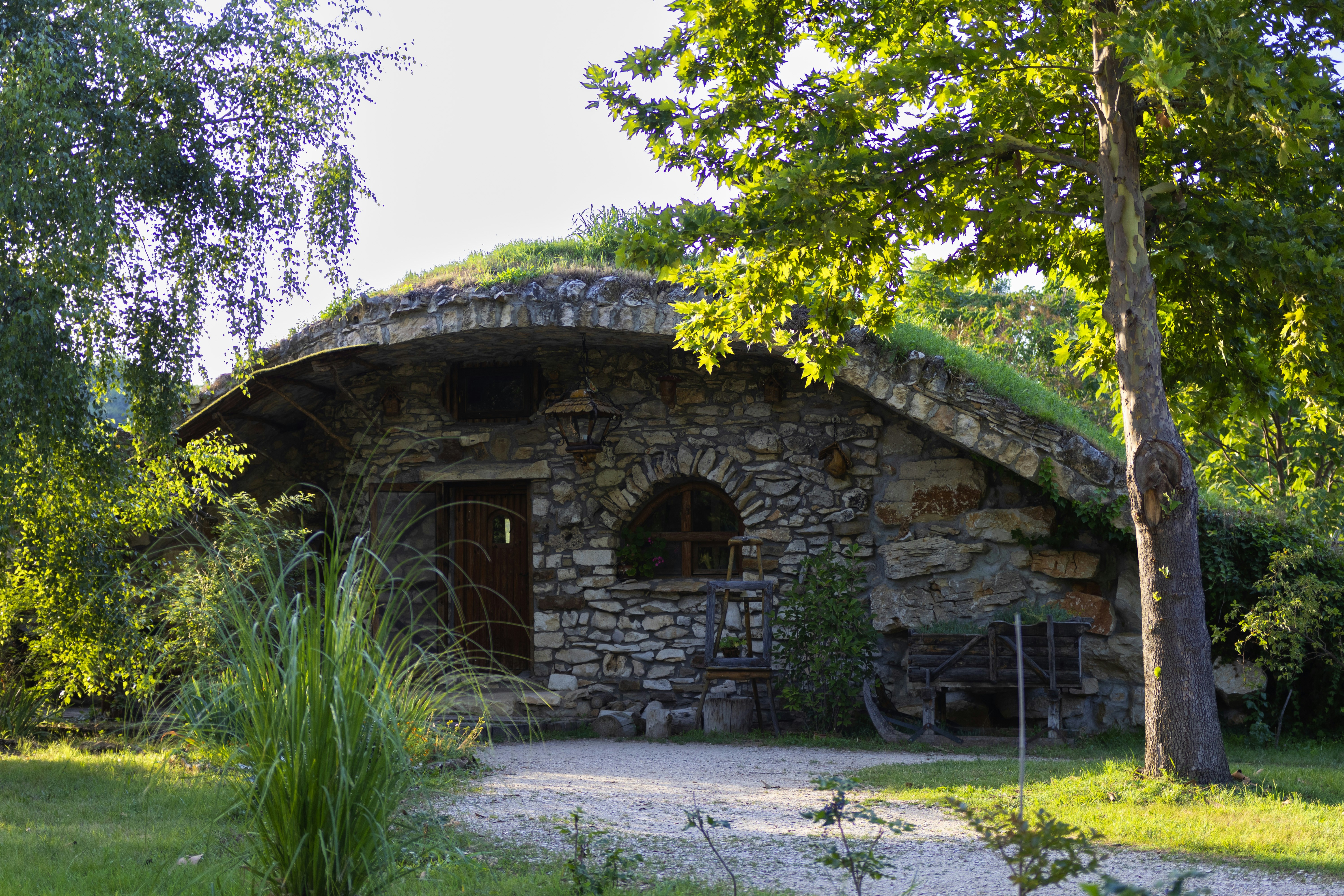A small stone building with a grass roof photo – Free Lukovit Image on ...