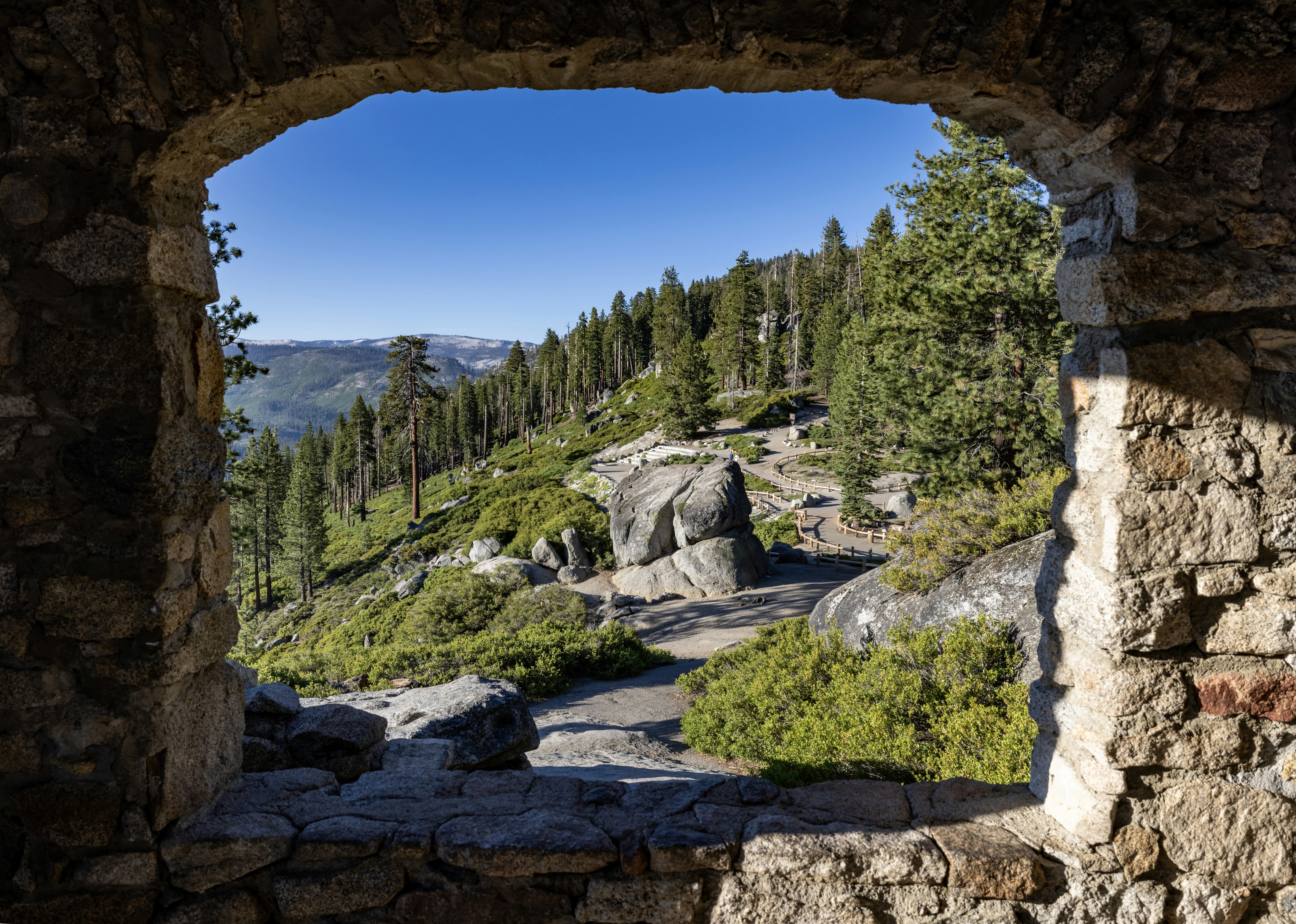A little stone building showing some history of Glacier Point but also creating the perfect "view through" for an amazing spot.