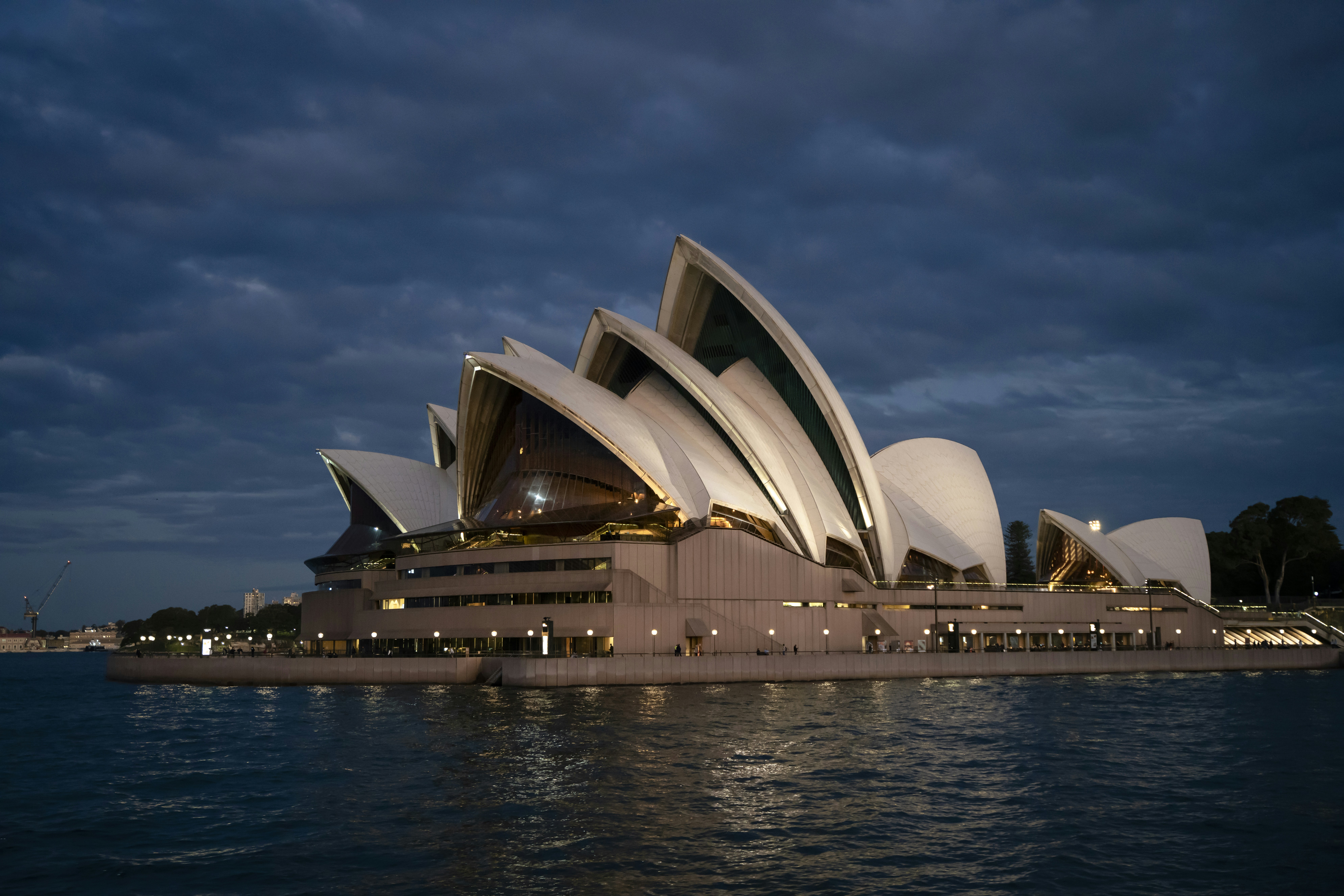 The sydney opera house is lit up at night photo – Free Building Image ...