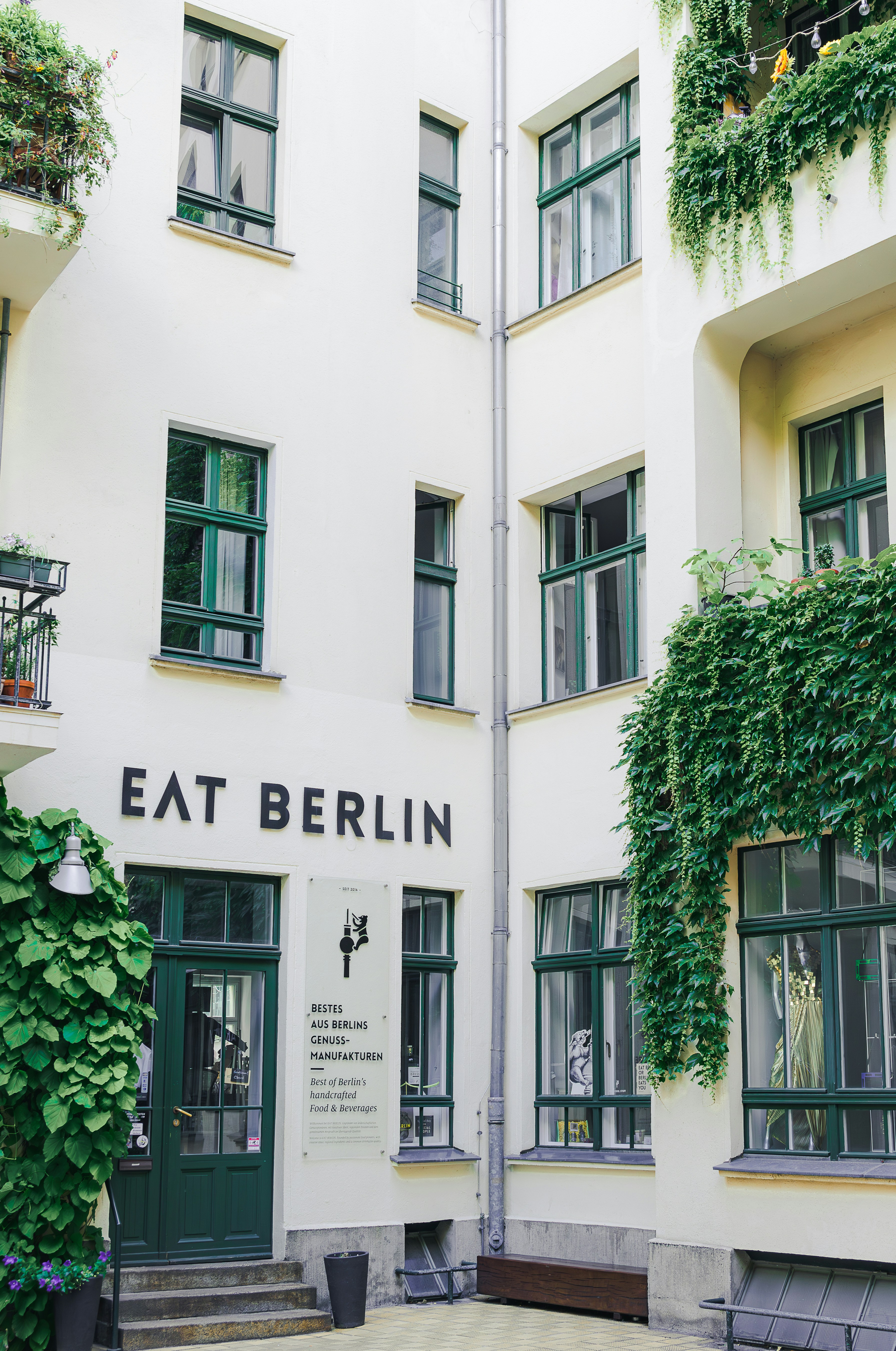 Ivy-Clad White Courtyard: The Eat Berlin Doorway