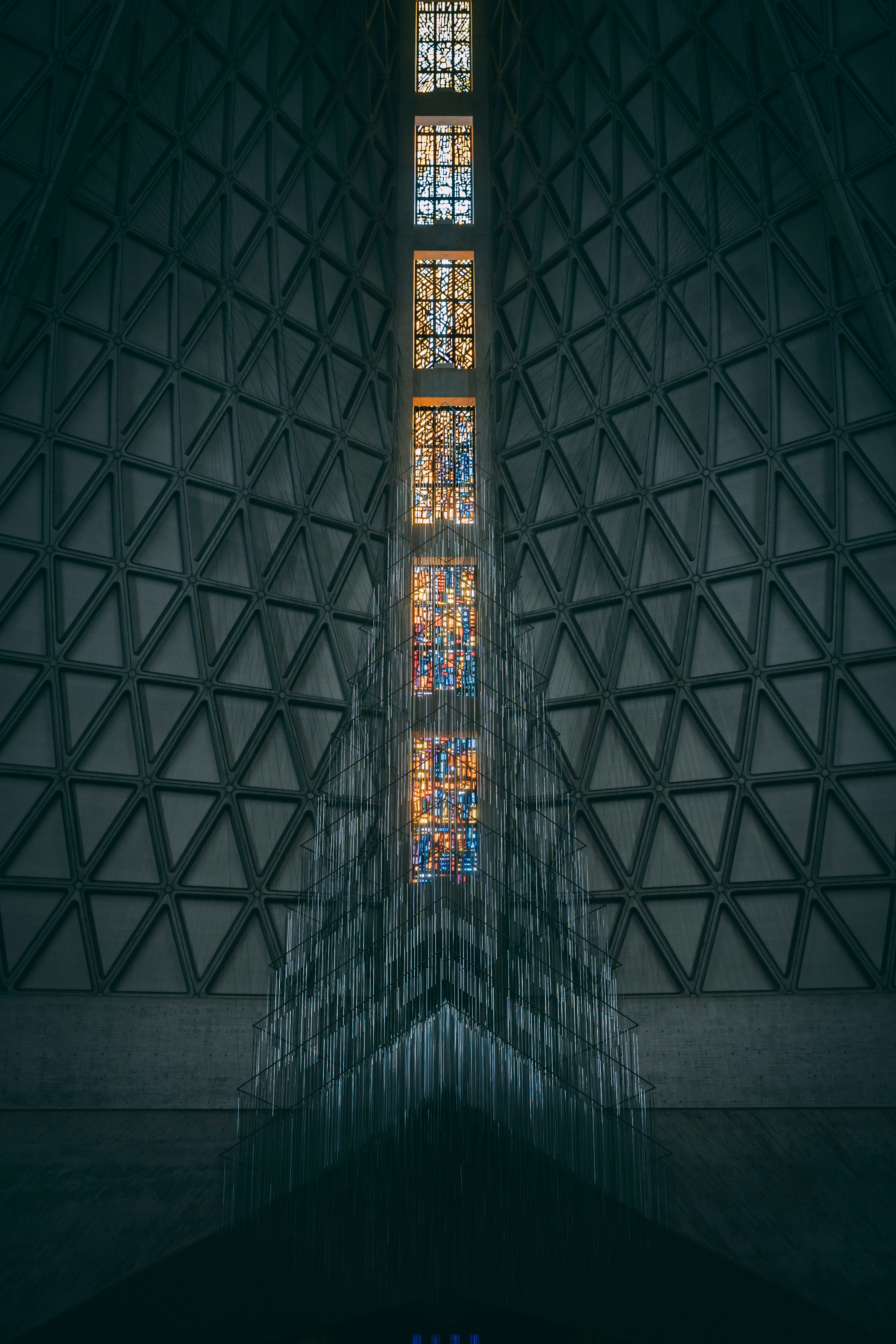 A very tall building with a very large window photo – Free Building ...