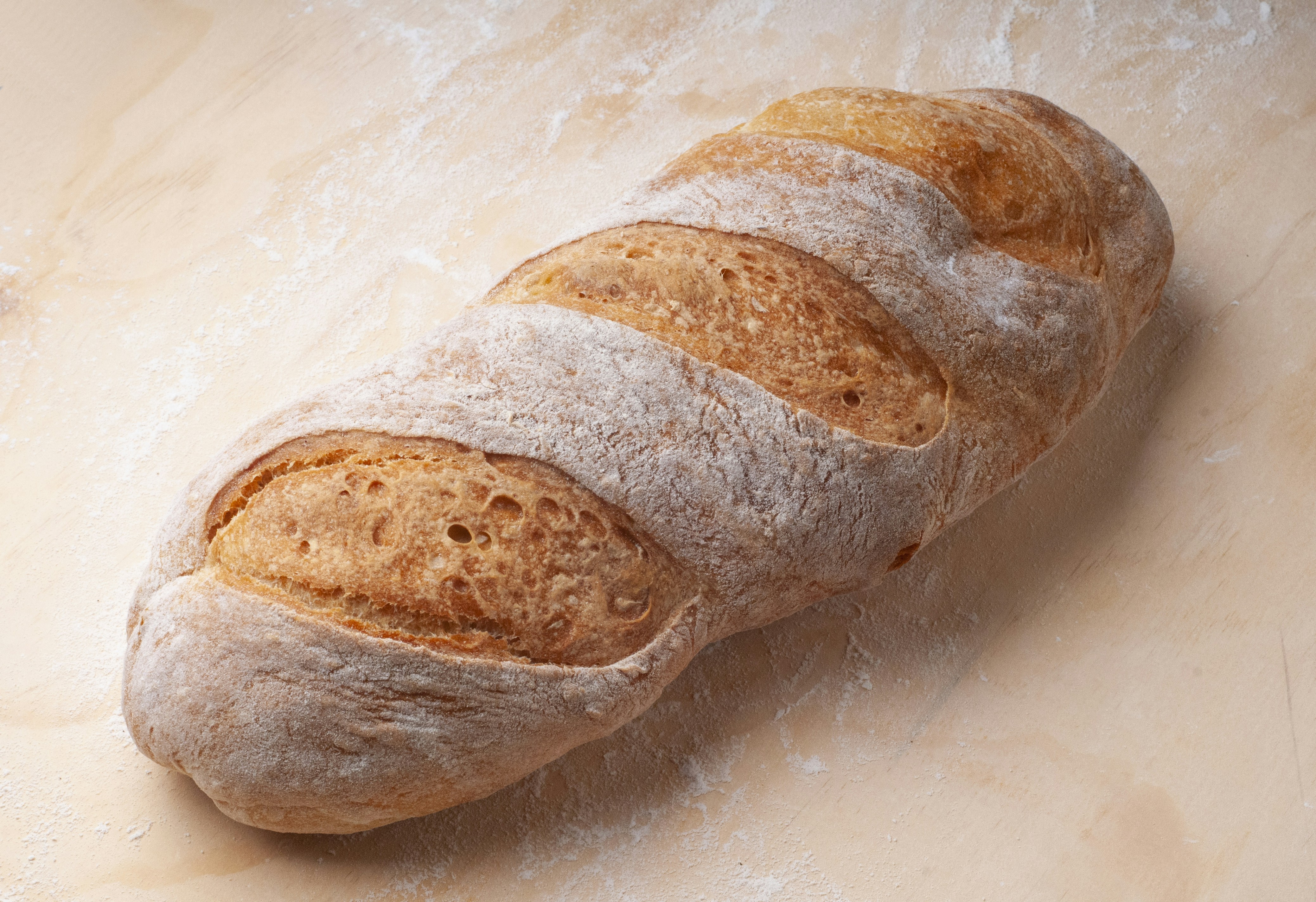 A loaf of bread sitting on top of a counter photo – Free Food Image on ...