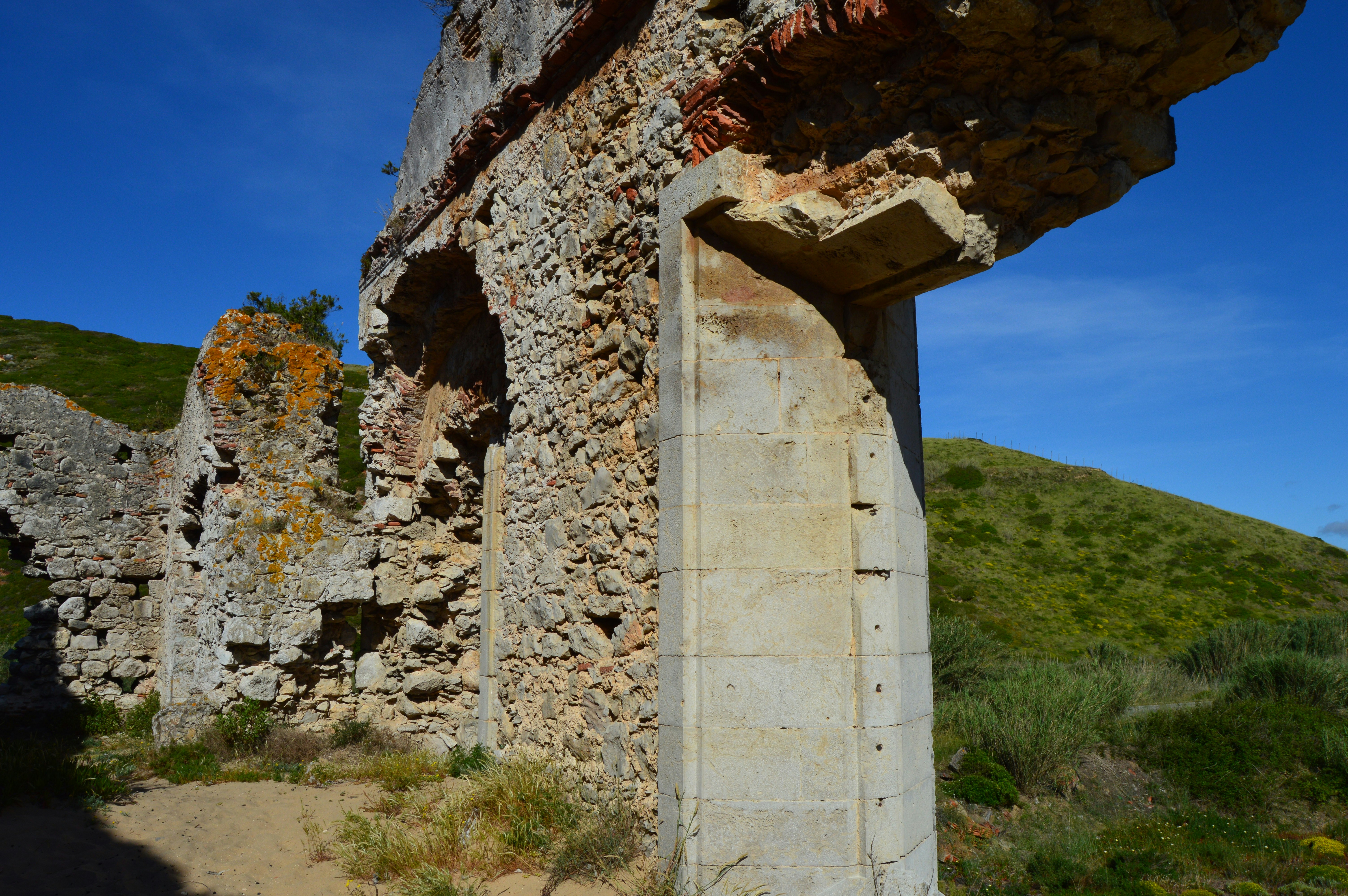 A very old building with a big rock on top of it photo – Free Ruins ...