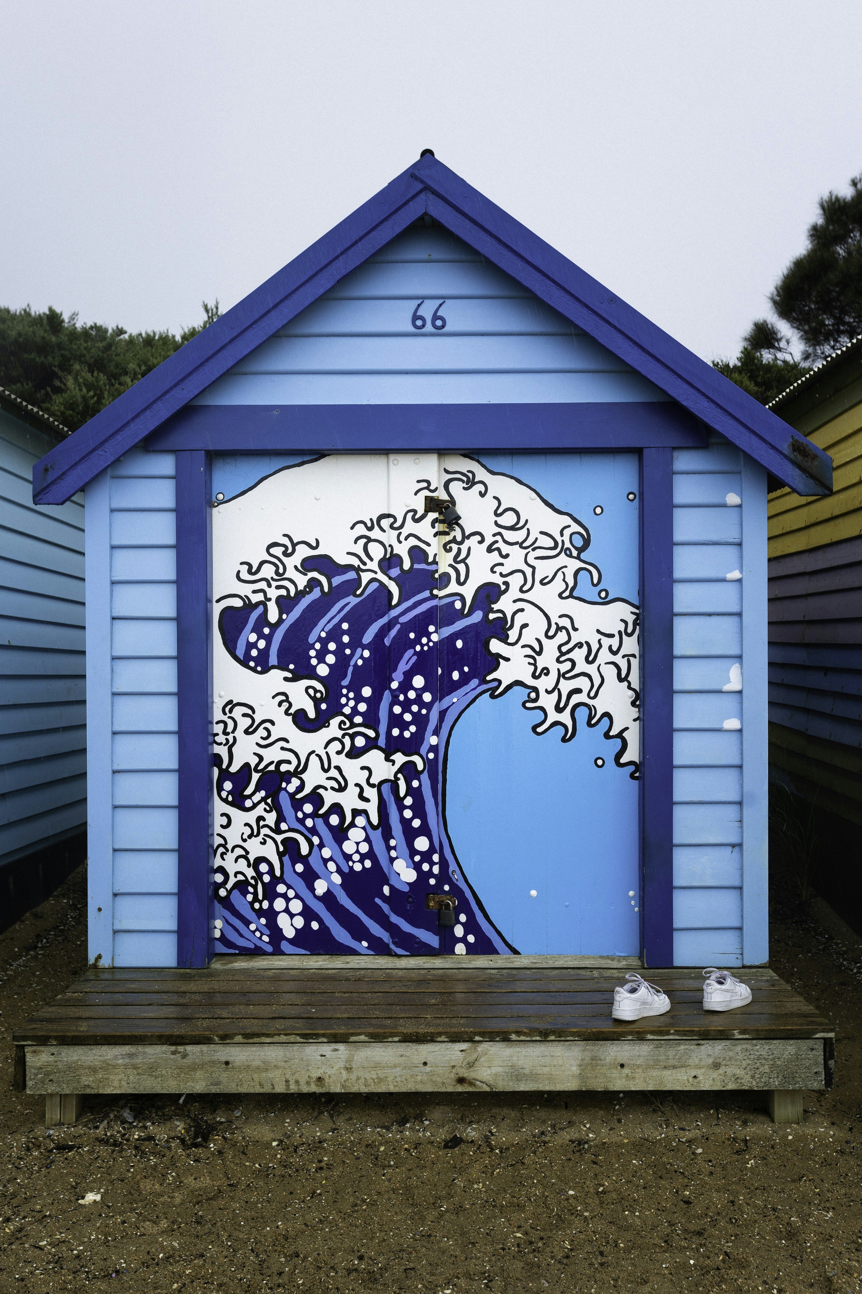 Wave of Color: Blue Lifeguard Hut with Surfer Portrait