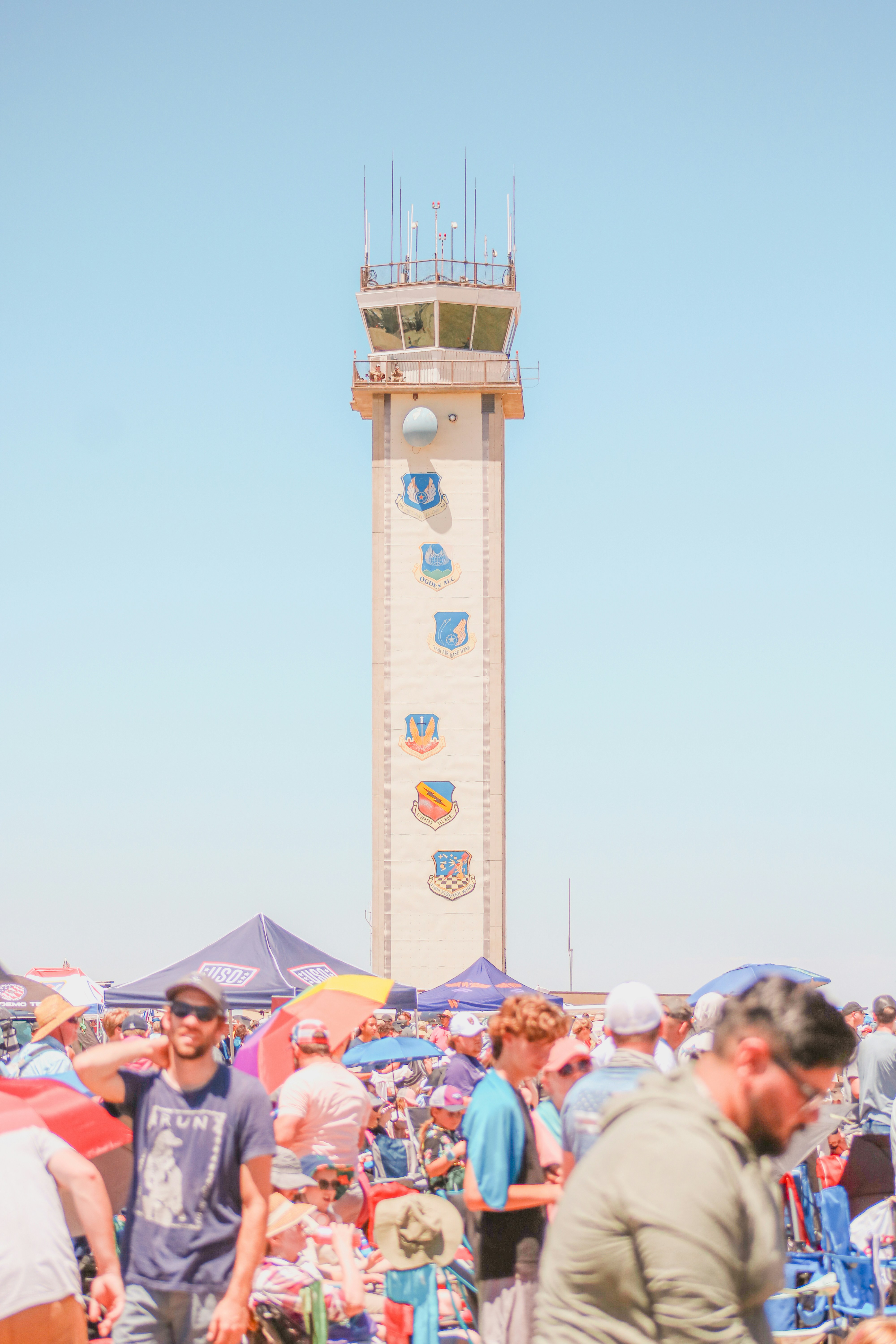 Skyward Watchtower Over a Sunlit Beach Crowd