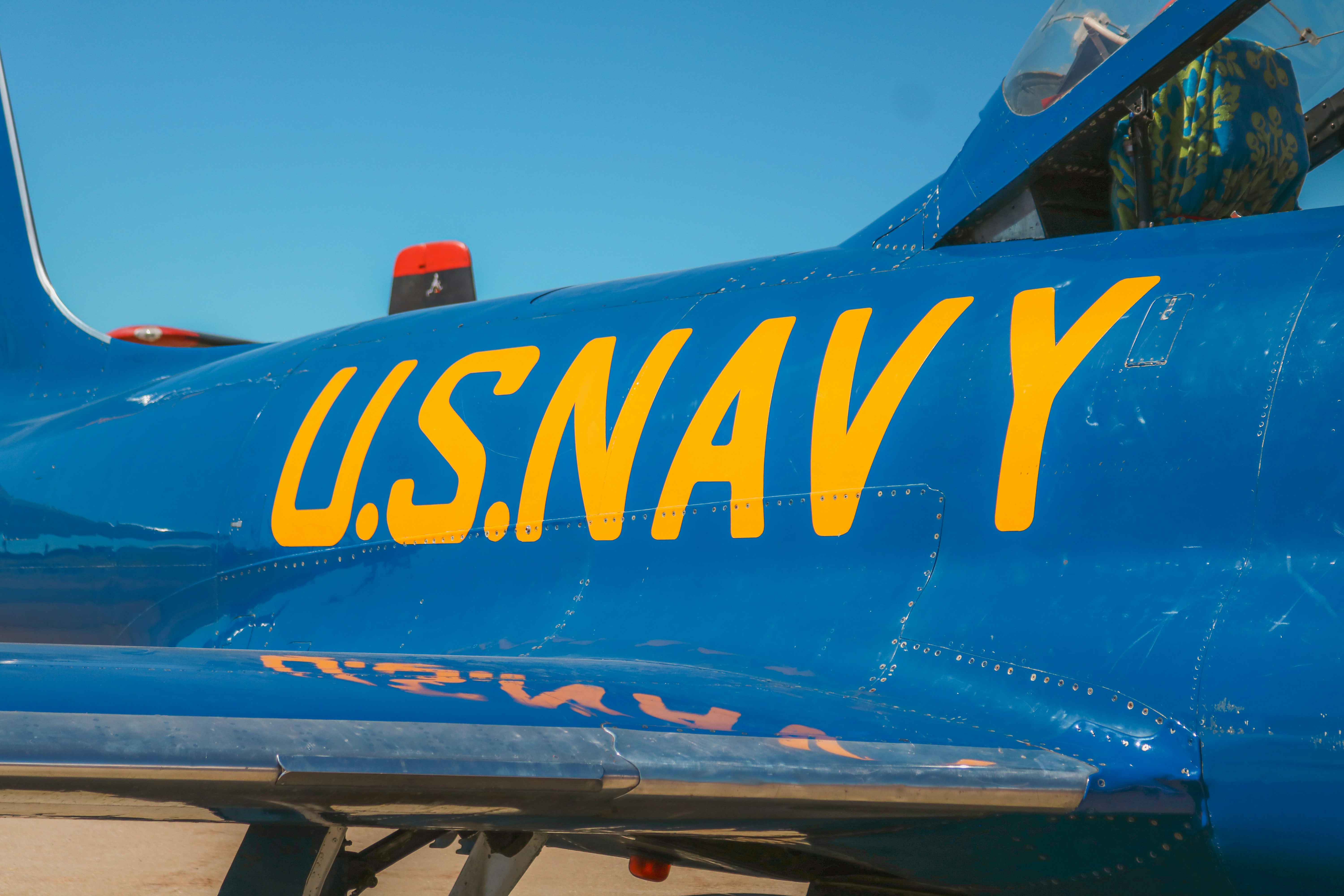 Blue Sky, Bold Letters: The Navy Plane's Side Shot