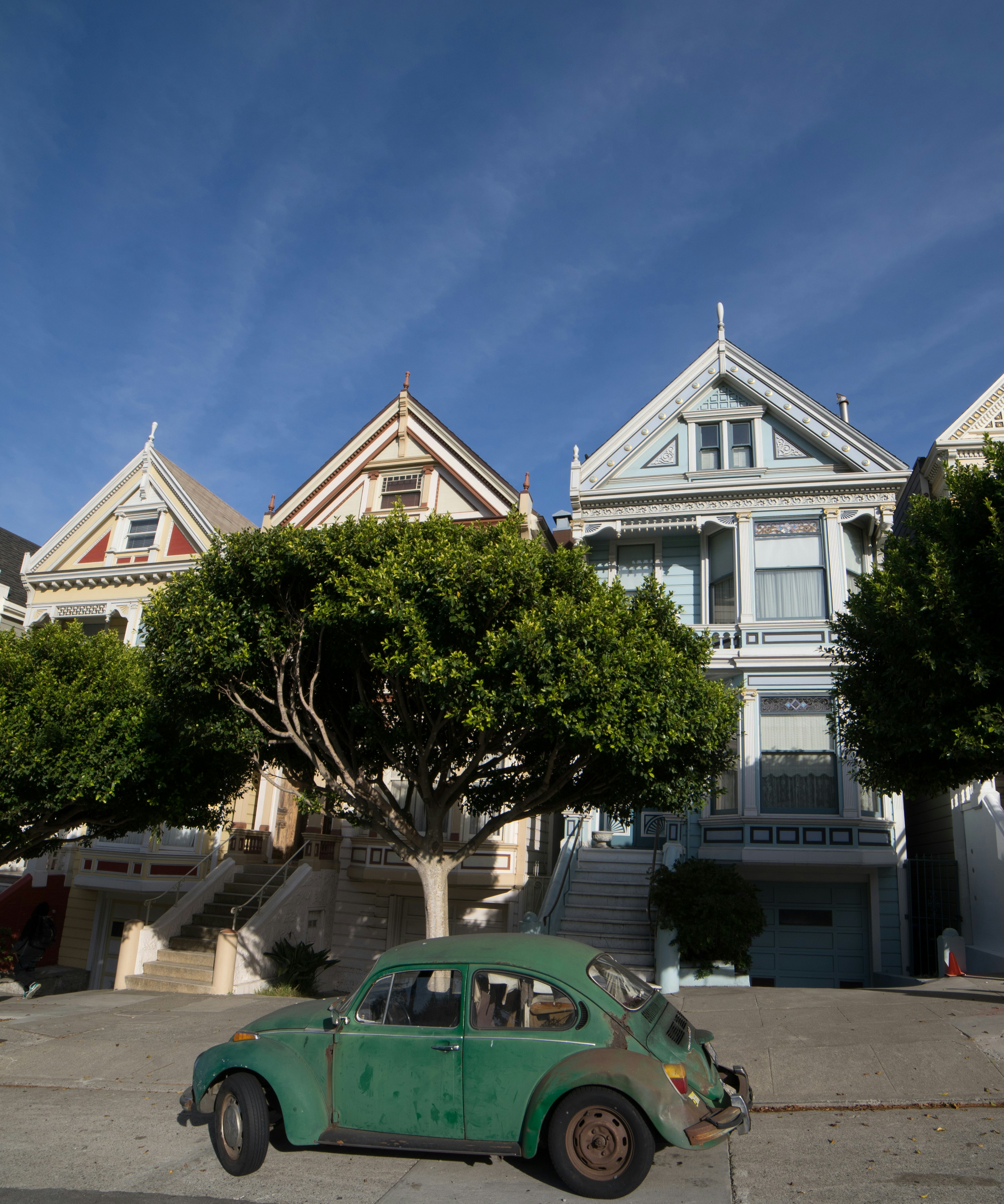 Green VW Beetle Before San Francisco's Painted Ladies