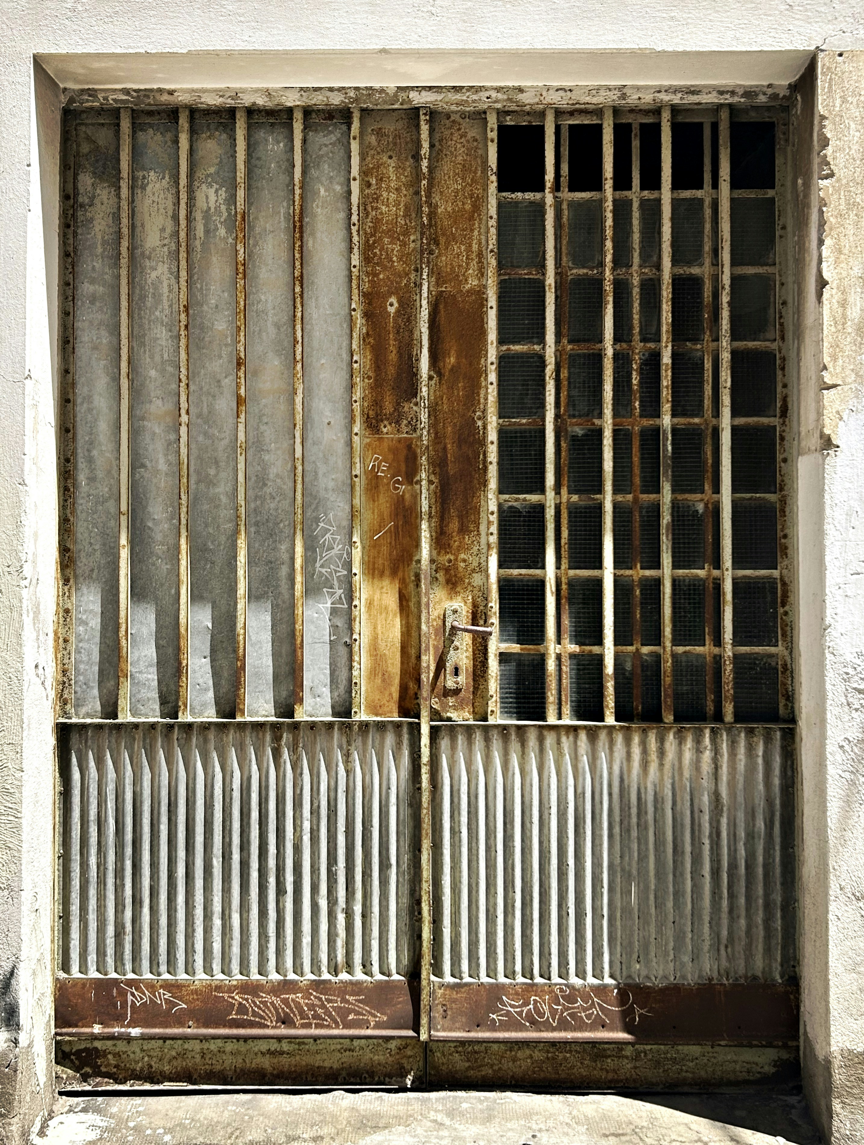 An old jail cell door with bars on it photo – Free Door Image on Unsplash