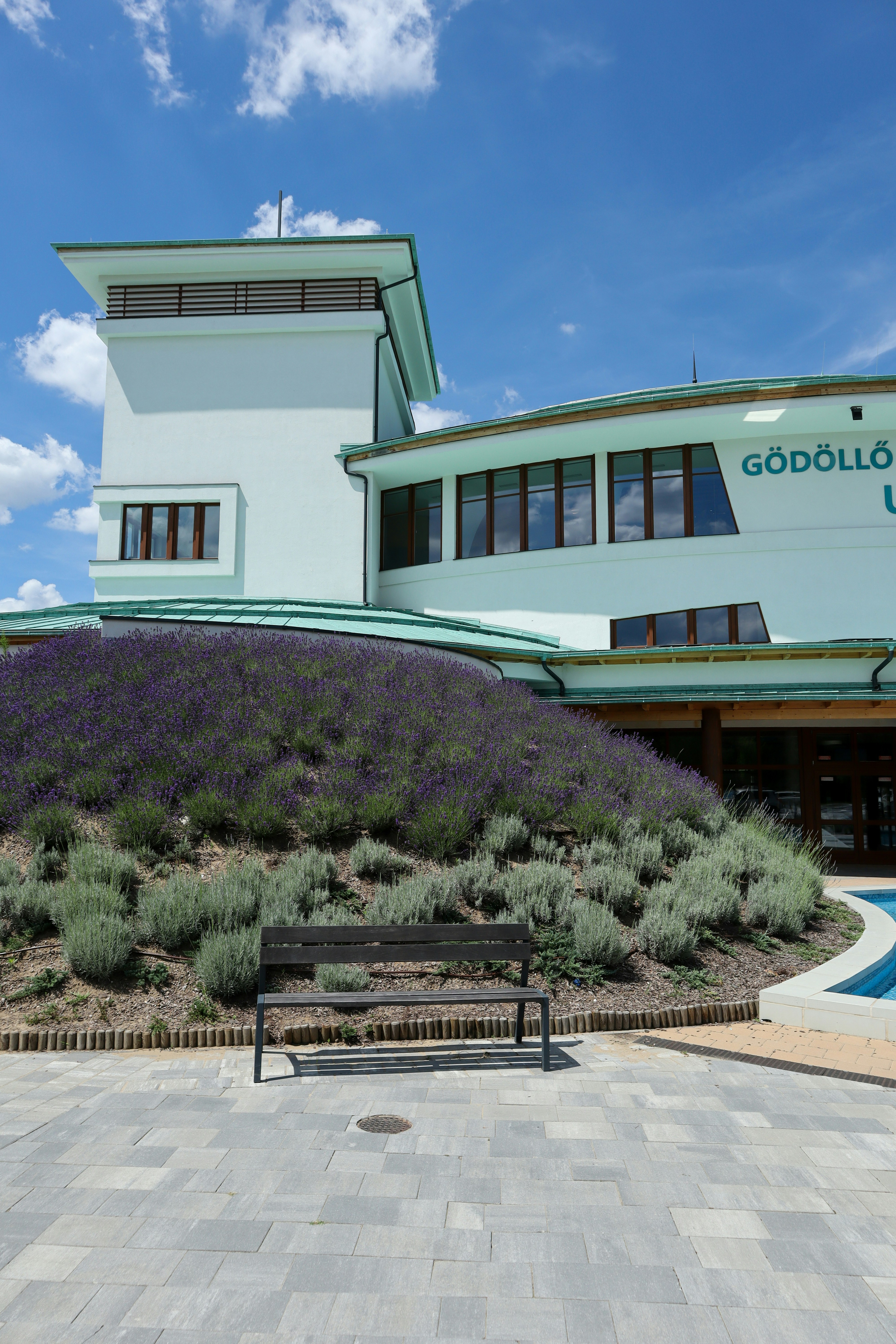 Mint Facade and Lavender Ridge: Quiet Architecture Under a Cerulean Sky