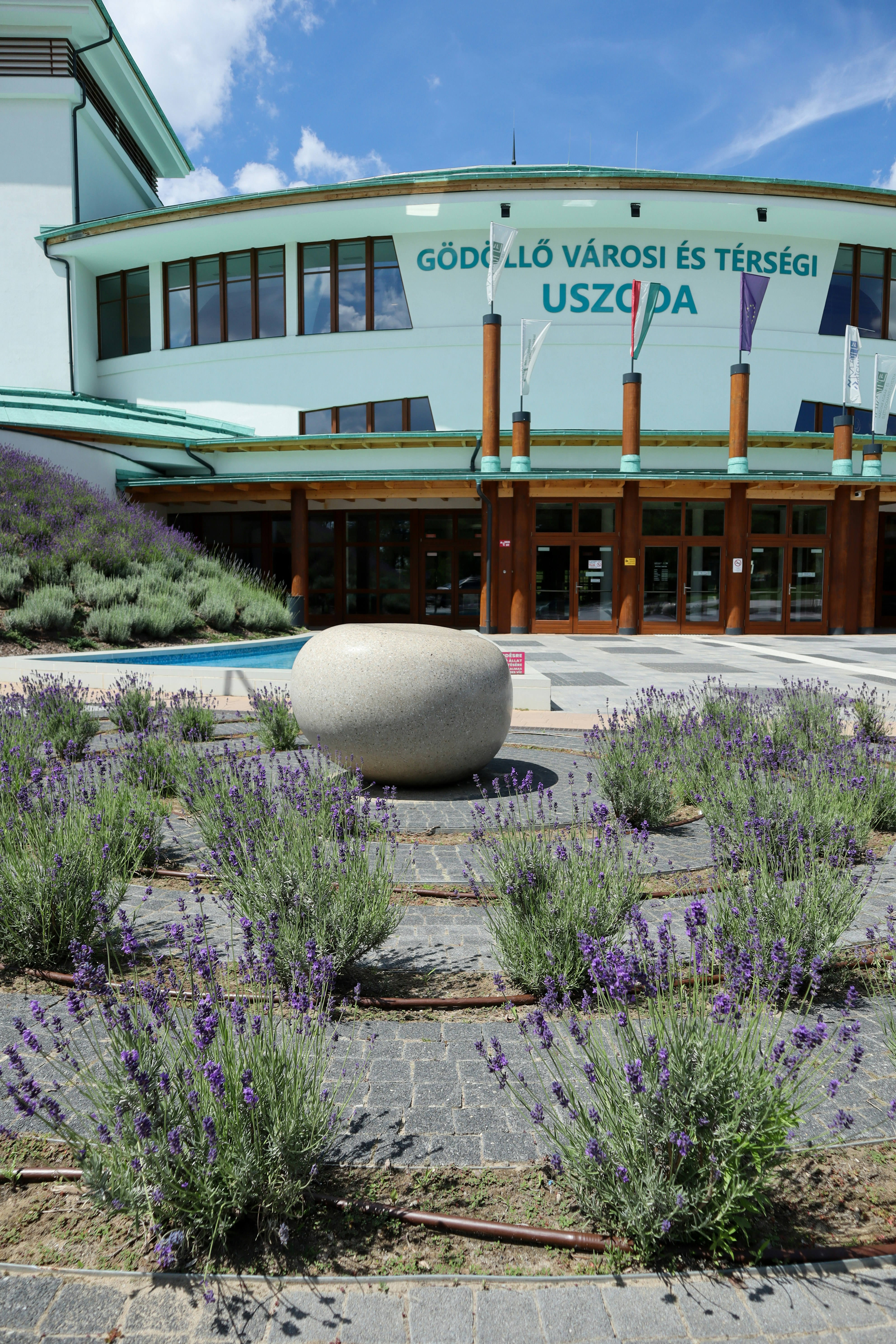 Lavender-drenched plaza guarding a civic entrance