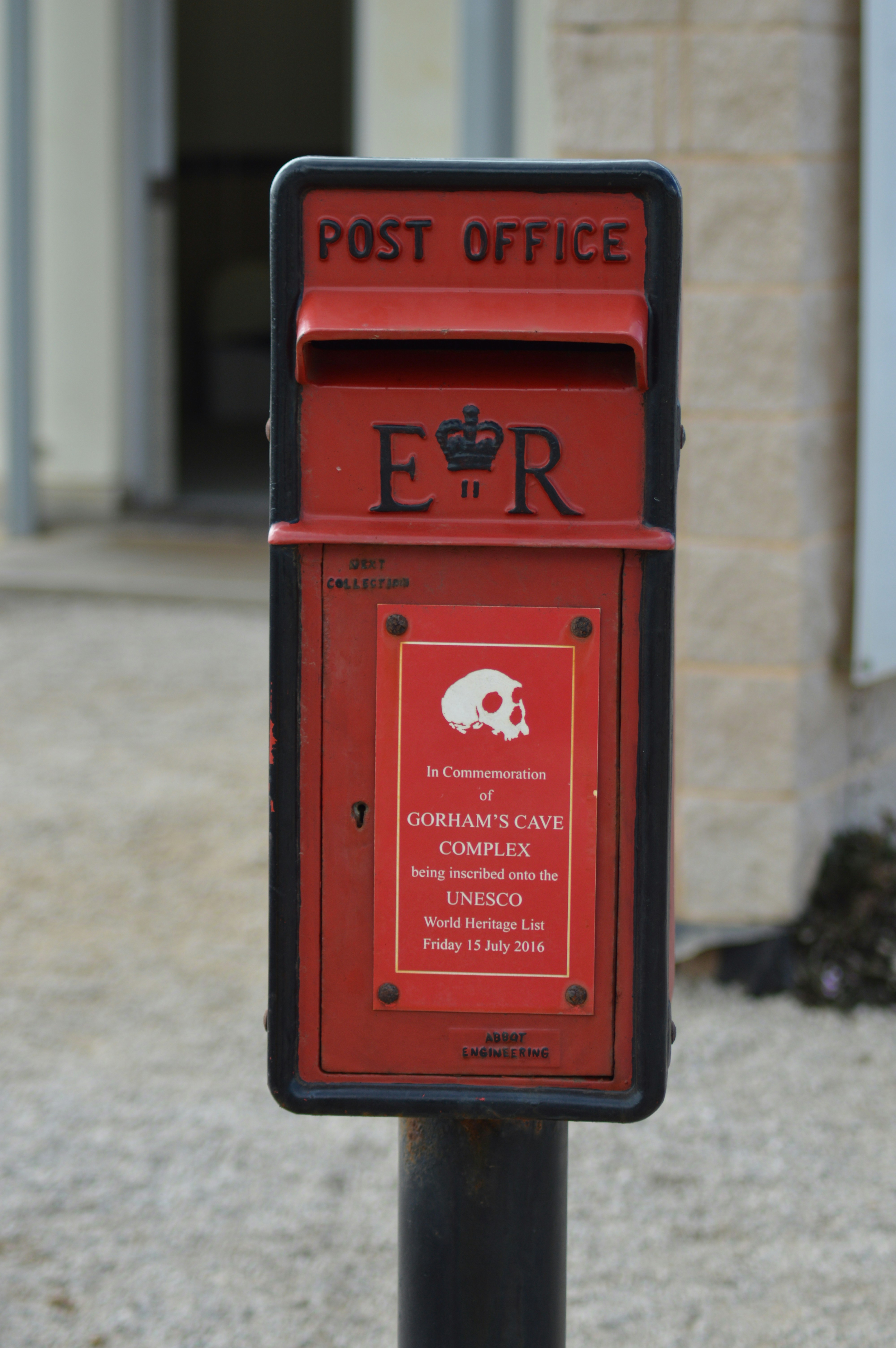 A red post box sitting on the side of a road photo – Free Gibraltar ...