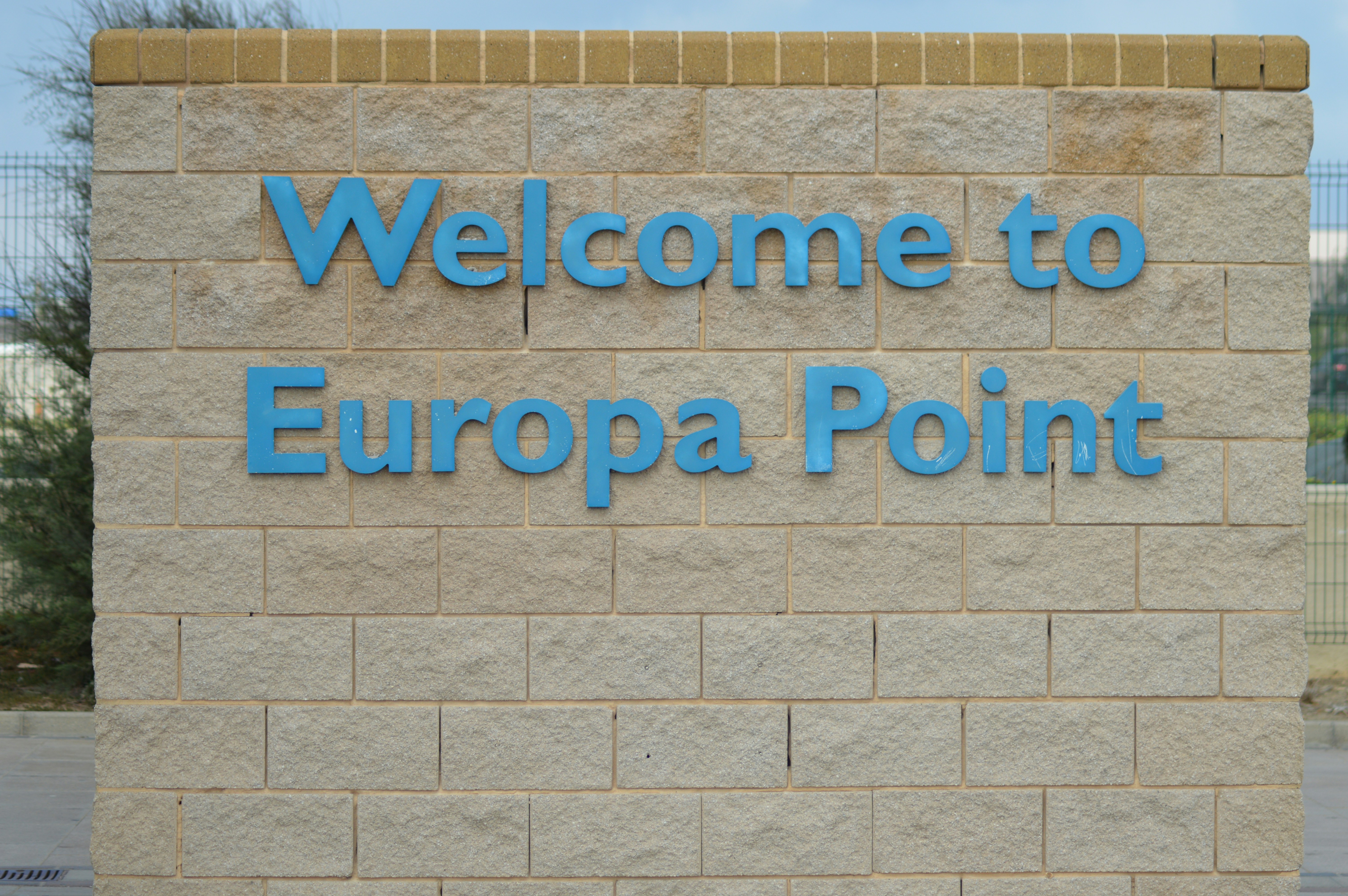 A welcome sign to europe point in front of a building photo – Free ...