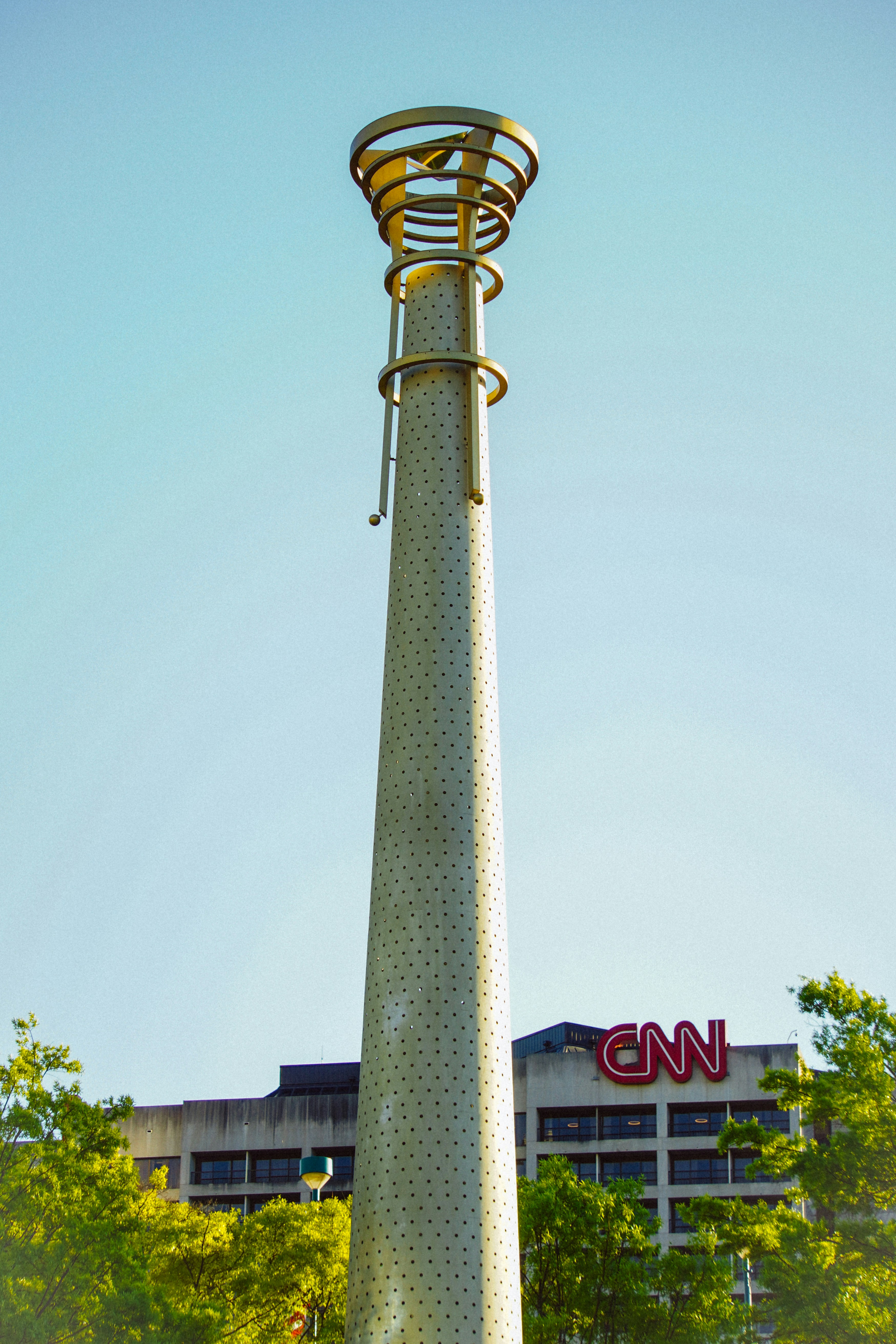 A tall metal pole with a spiral design on top of it photo – Free ...