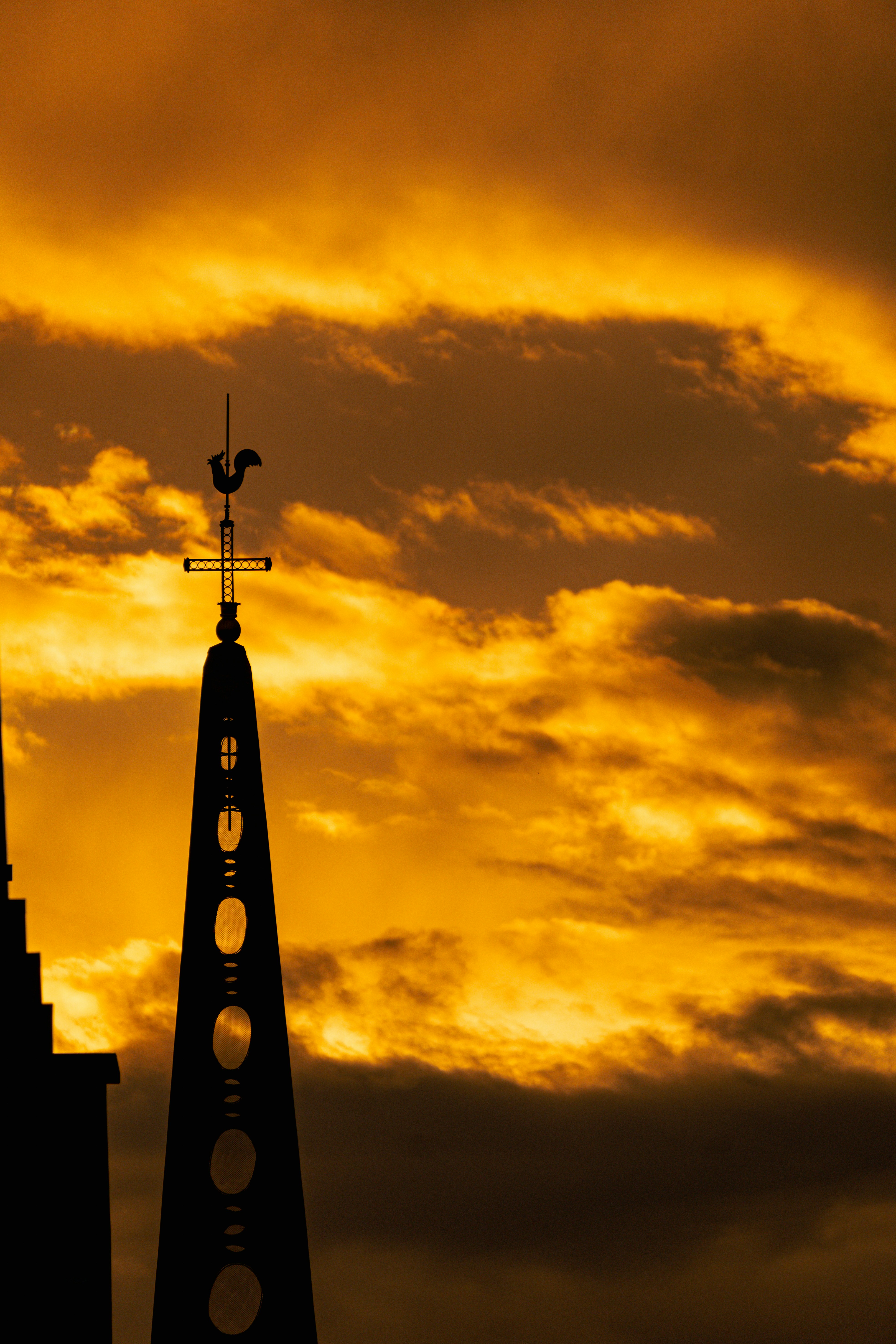 Ember-Glow Spire: Rooster Weather Vane Silhouette at Sunset