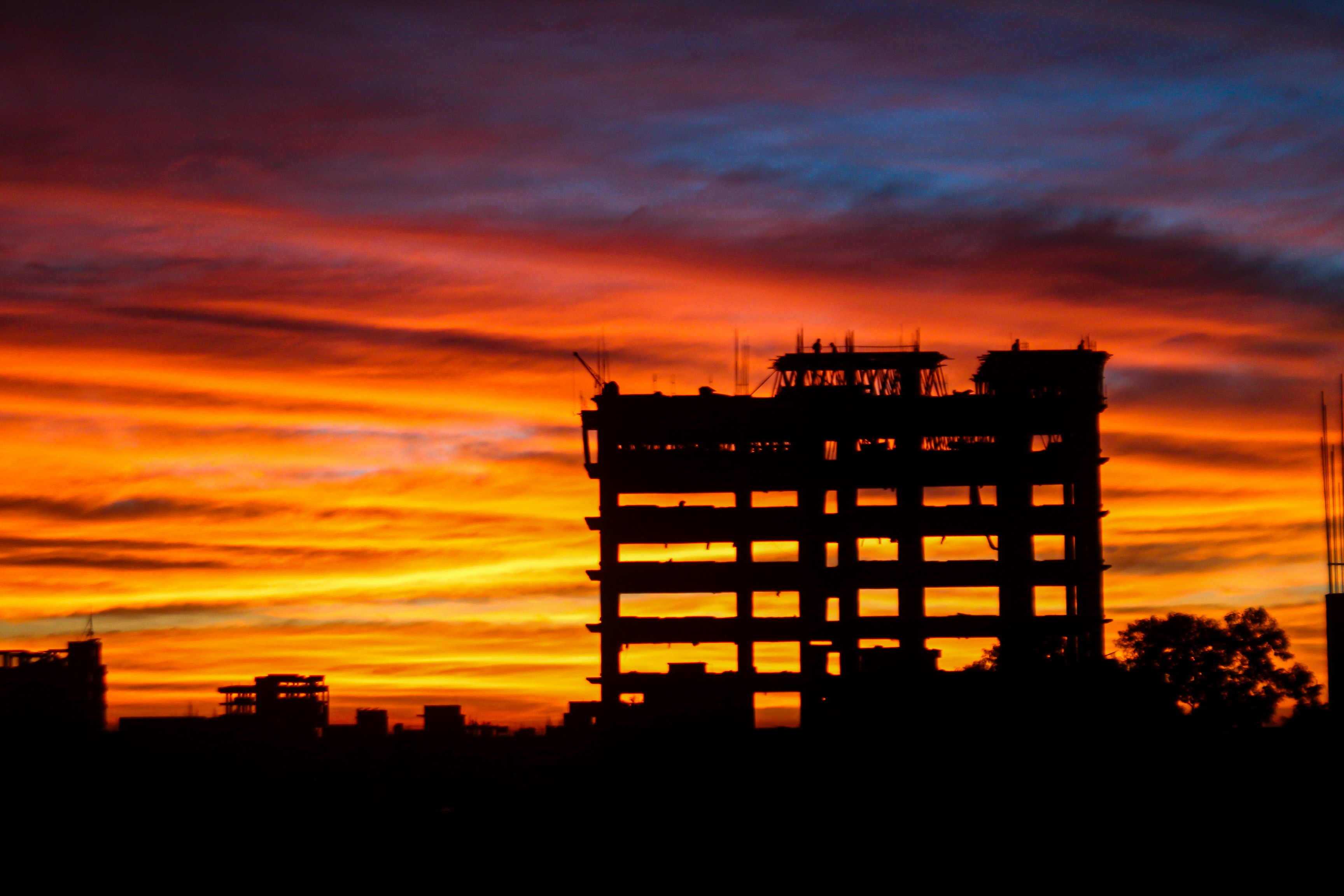 Urban Silhouette Against Fiery Skies