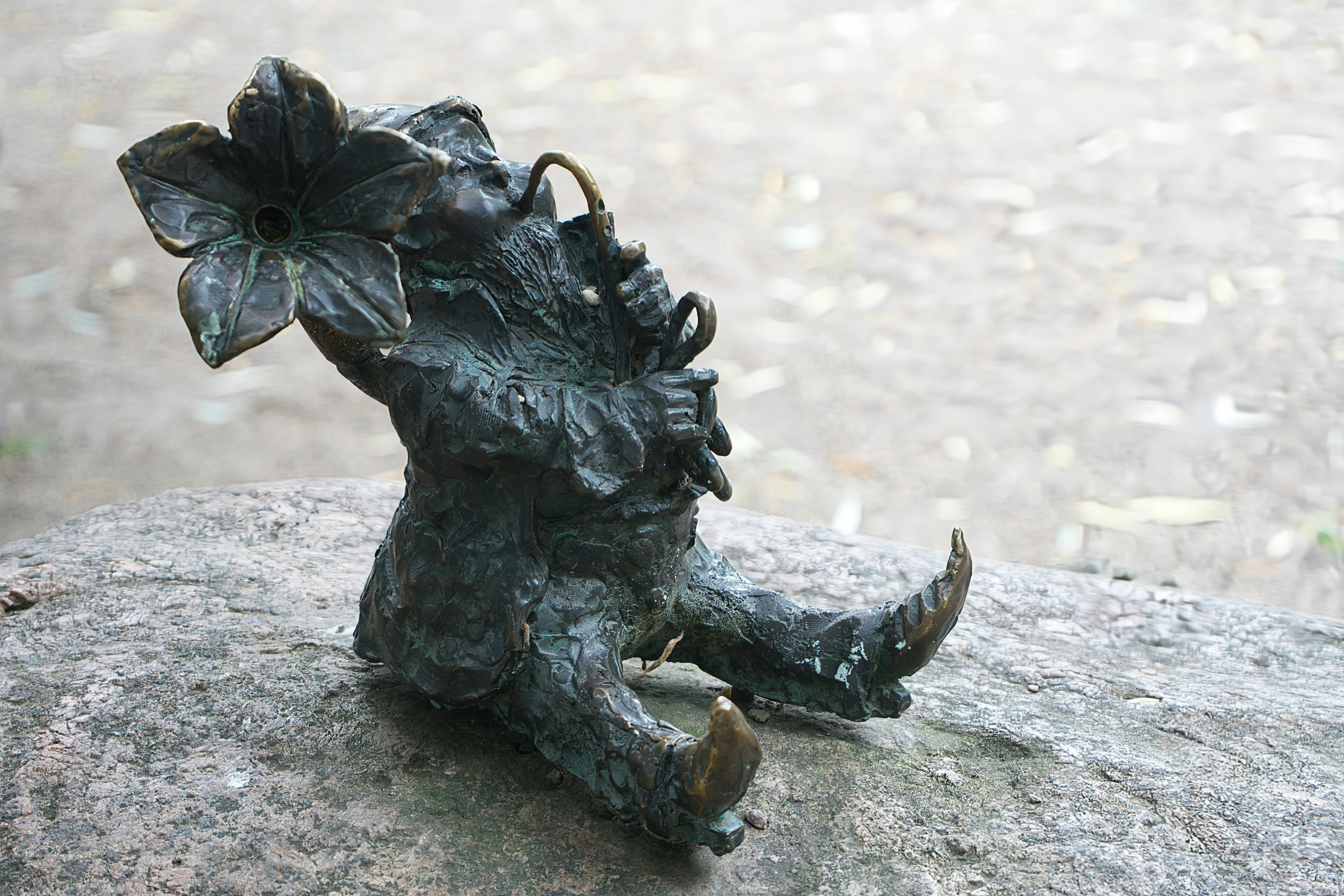 A Quiet Ritual: The Small Figurine Among Weathered Stone